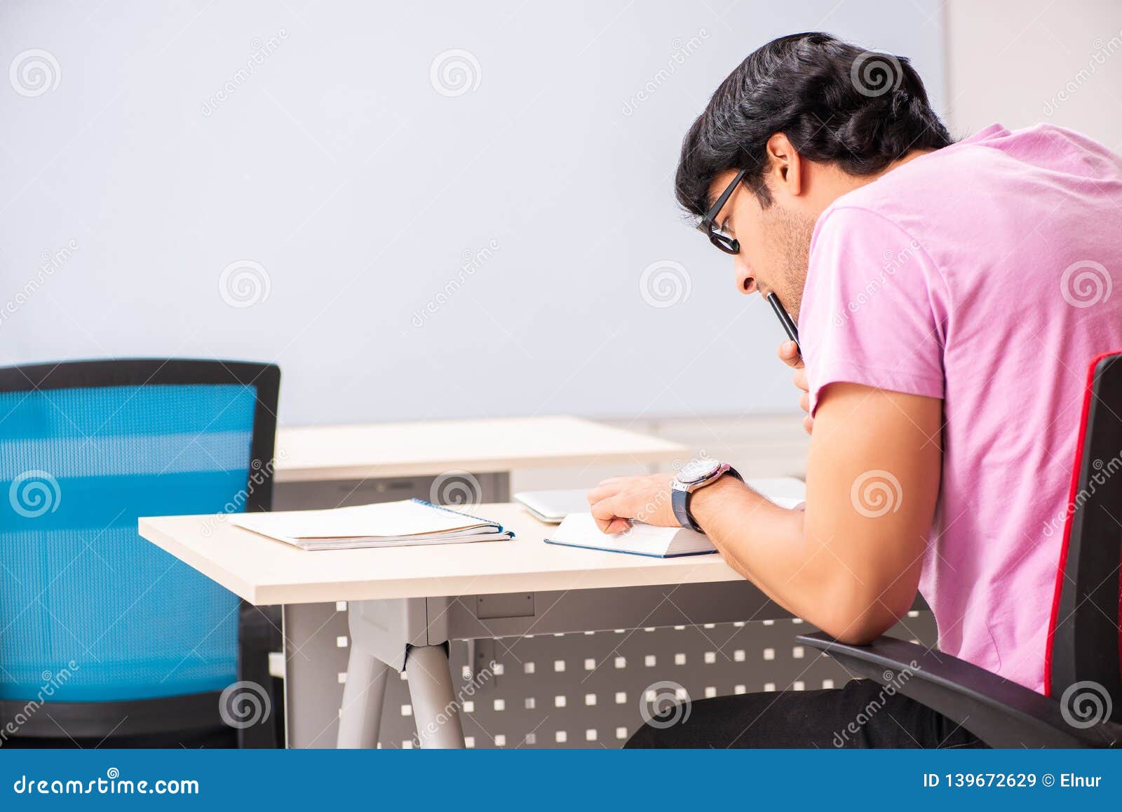 The Young Male Student Sitting in the Class Stock Image - Image of ...