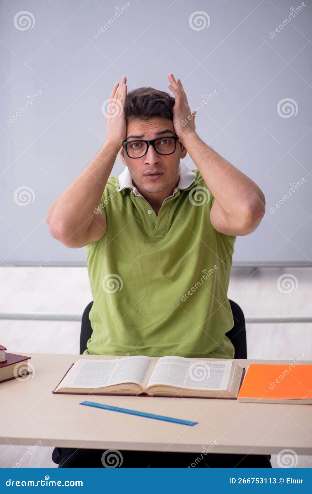 Young Male Student Sitting in the Classroom Stock Image - Image of exam ...