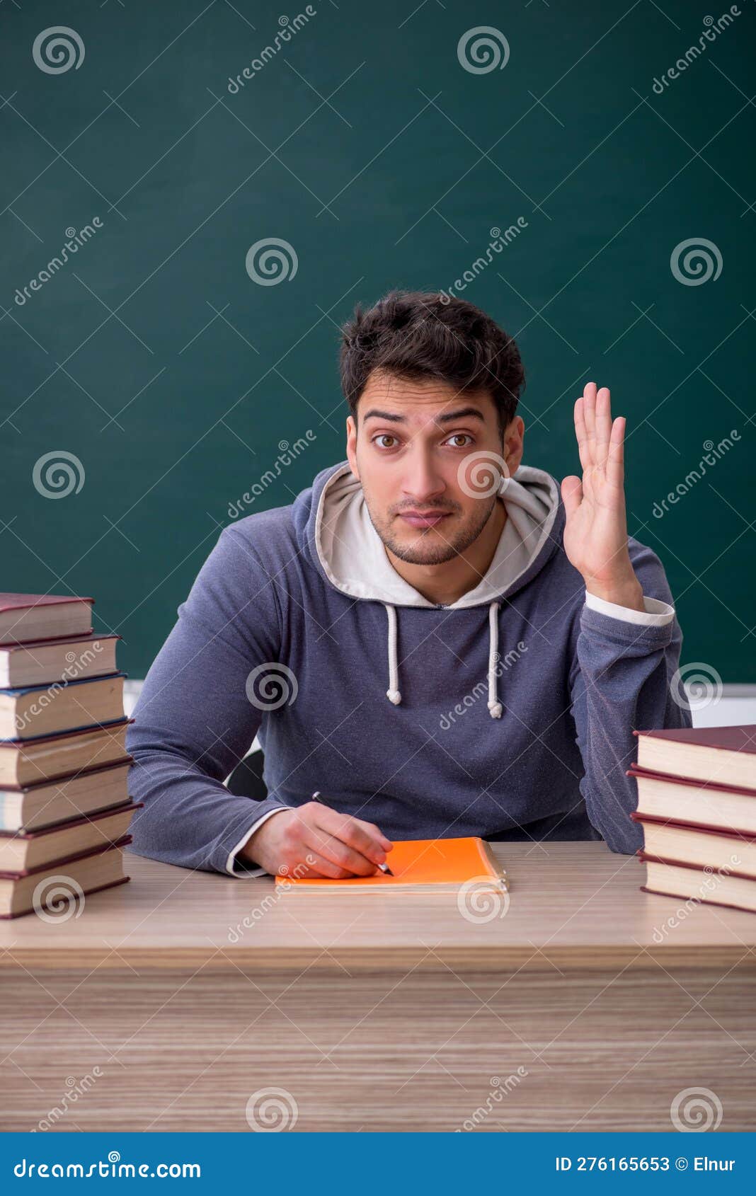 Young Male Student Sitting in the Classroom Stock Image - Image of ...