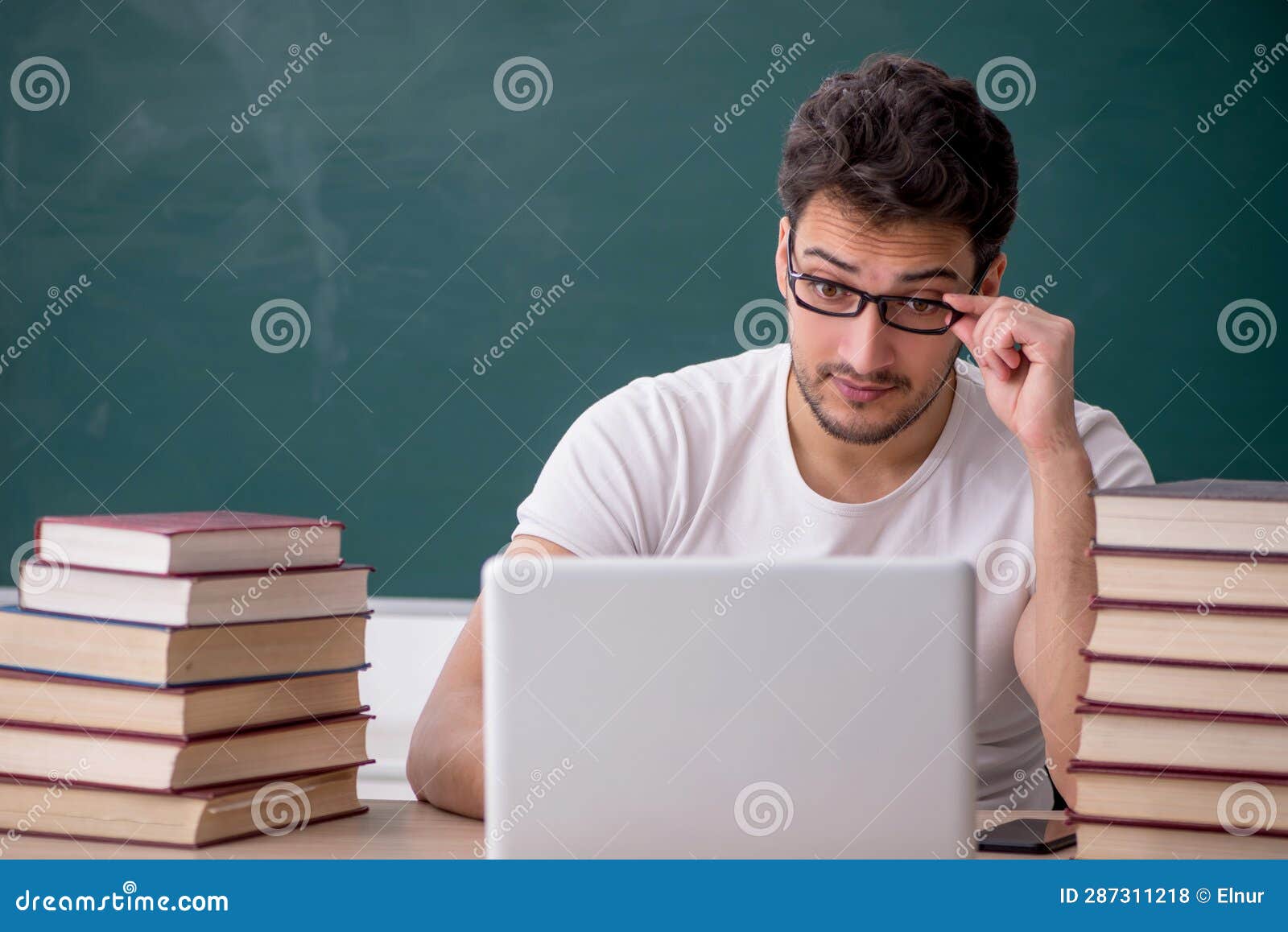 Young Male Student Sitting in the Classroom Stock Photo - Image of ...