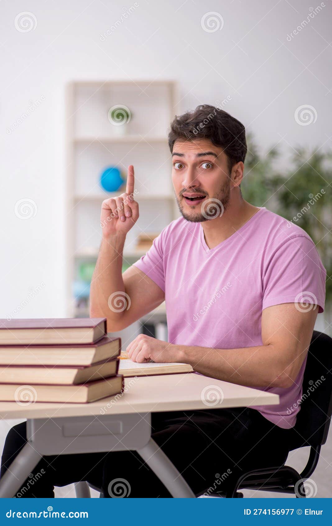 Young Male Student Sitting in the Classroom Stock Image - Image of ...