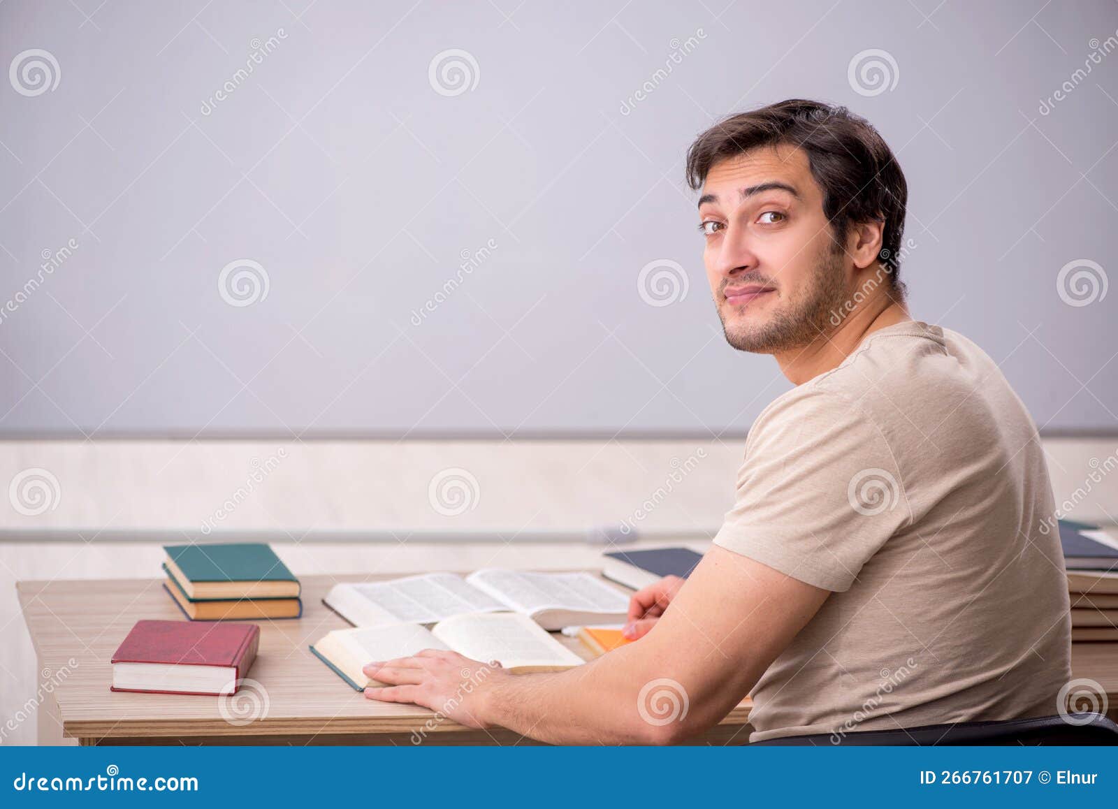 Young Male Student Sitting in the Classroom Stock Image - Image of ...