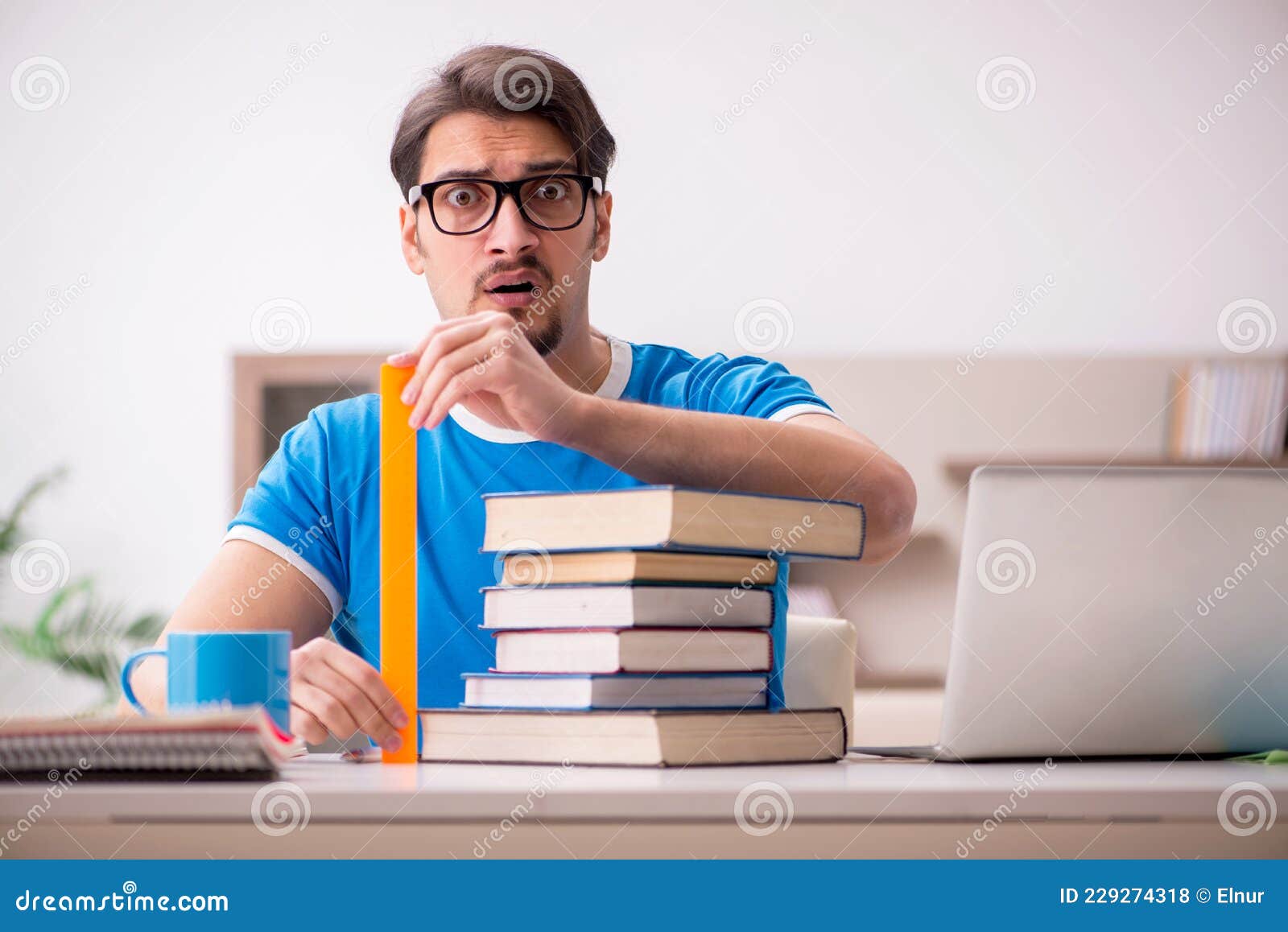 Young Male Student Studying at Home Stock Photo - Image of books ...