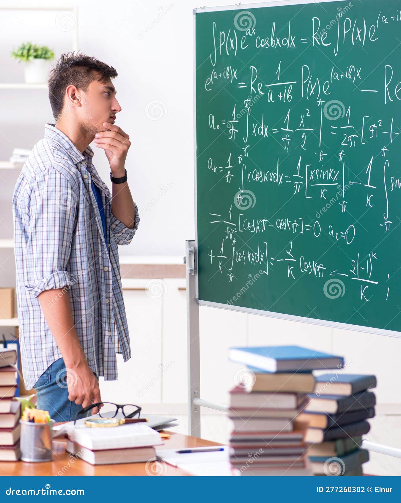 Young Male Student Studying Math at School Stock Photo - Image of ...