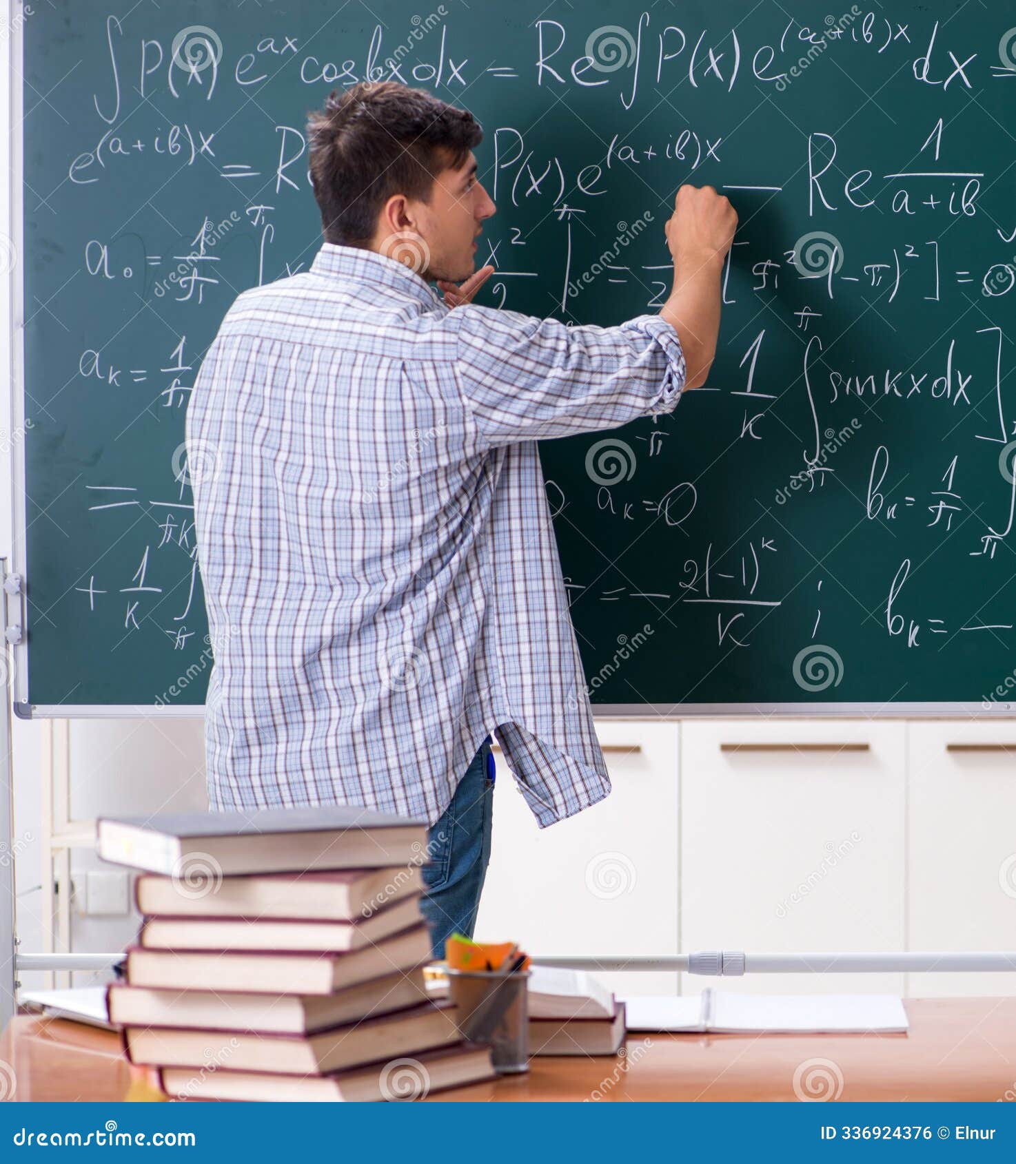 Young Male Student Studying Math at School Stock Photo - Image of math ...