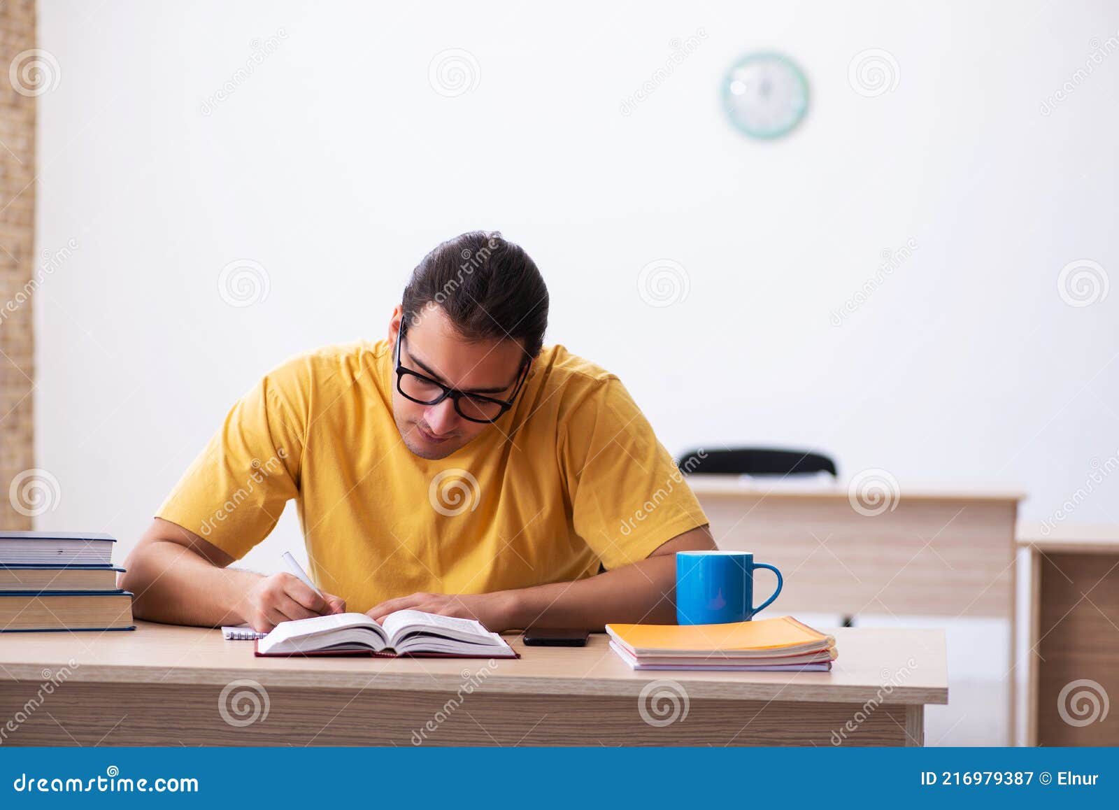 Young Male Student Taking Notes during Exam Preparation Stock Image ...