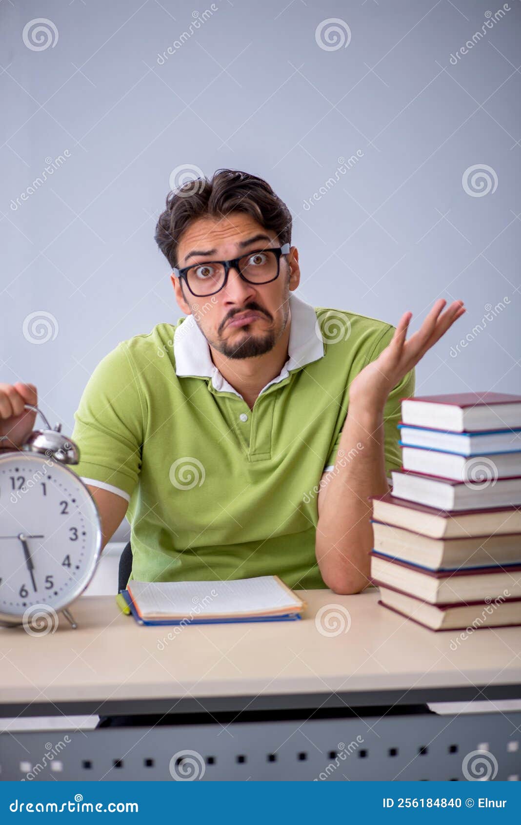 Young Male Student in Time Management Concept Stock Photo - Image of ...