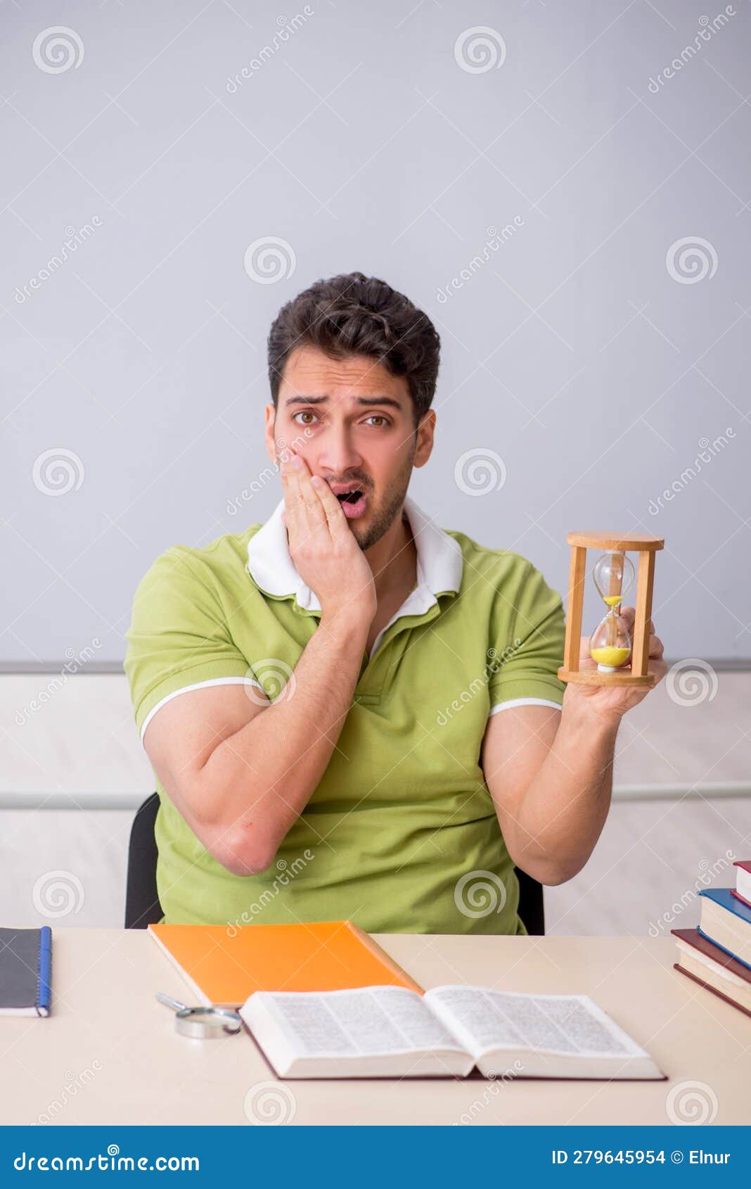 Young Male Student in Time Management Concept Stock Photo - Image of ...