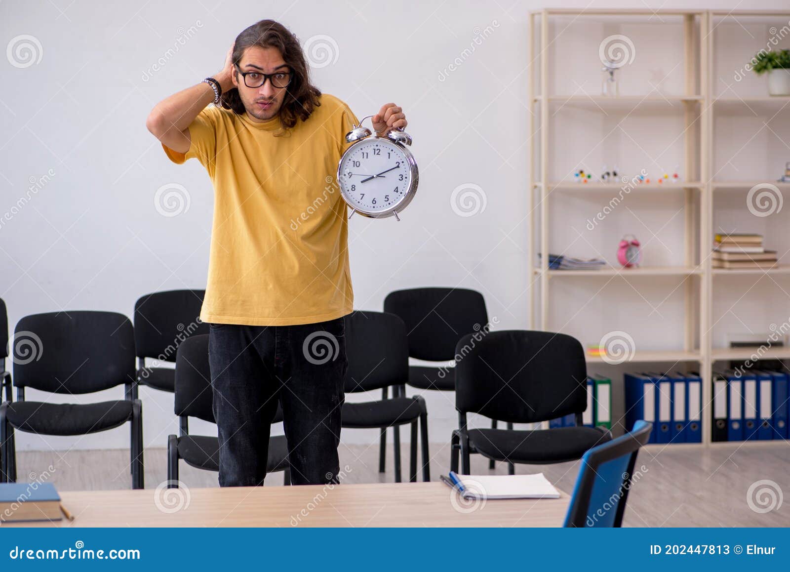 Young Male Student Waiting for Teacher in the Classroom Stock Image ...