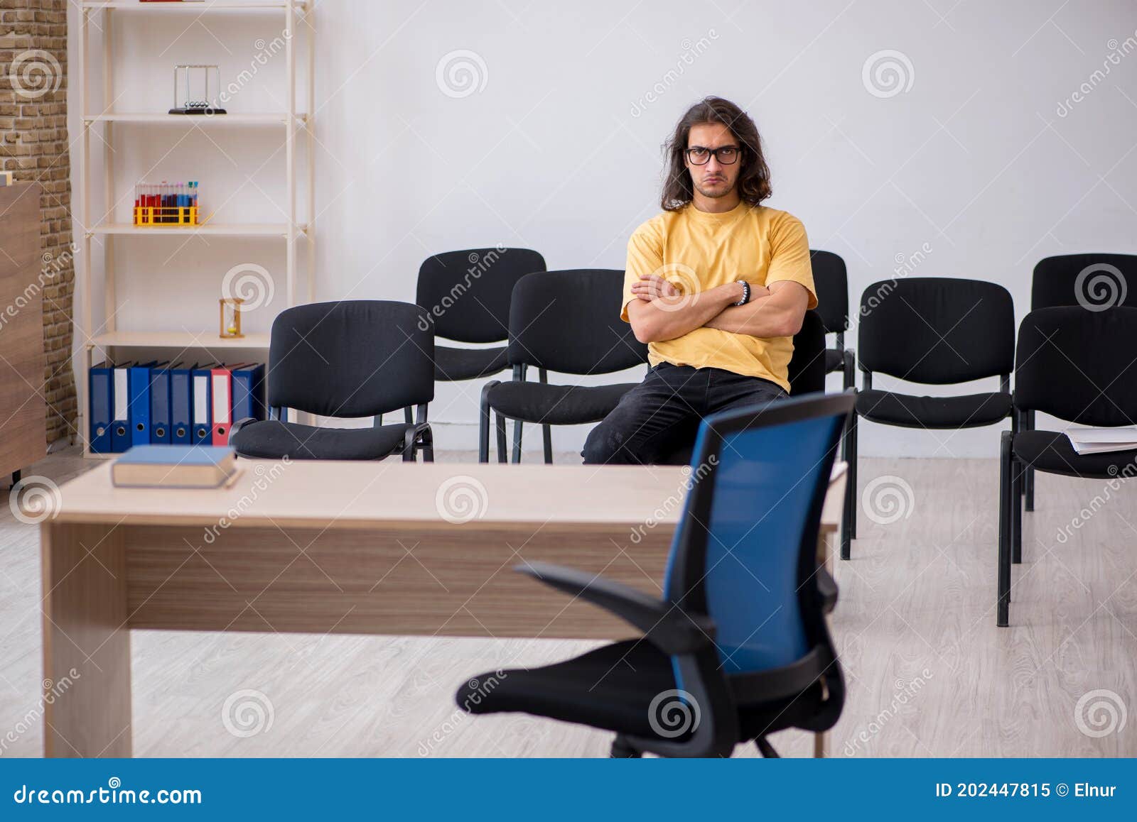 Young Male Student Waiting for Teacher in the Classroom Stock Image ...