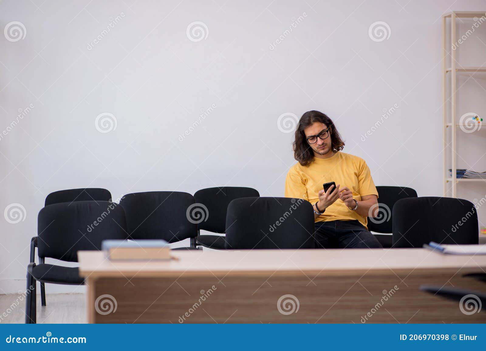 Young Male Student Waiting for Teacher in the Classroom Stock Photo ...