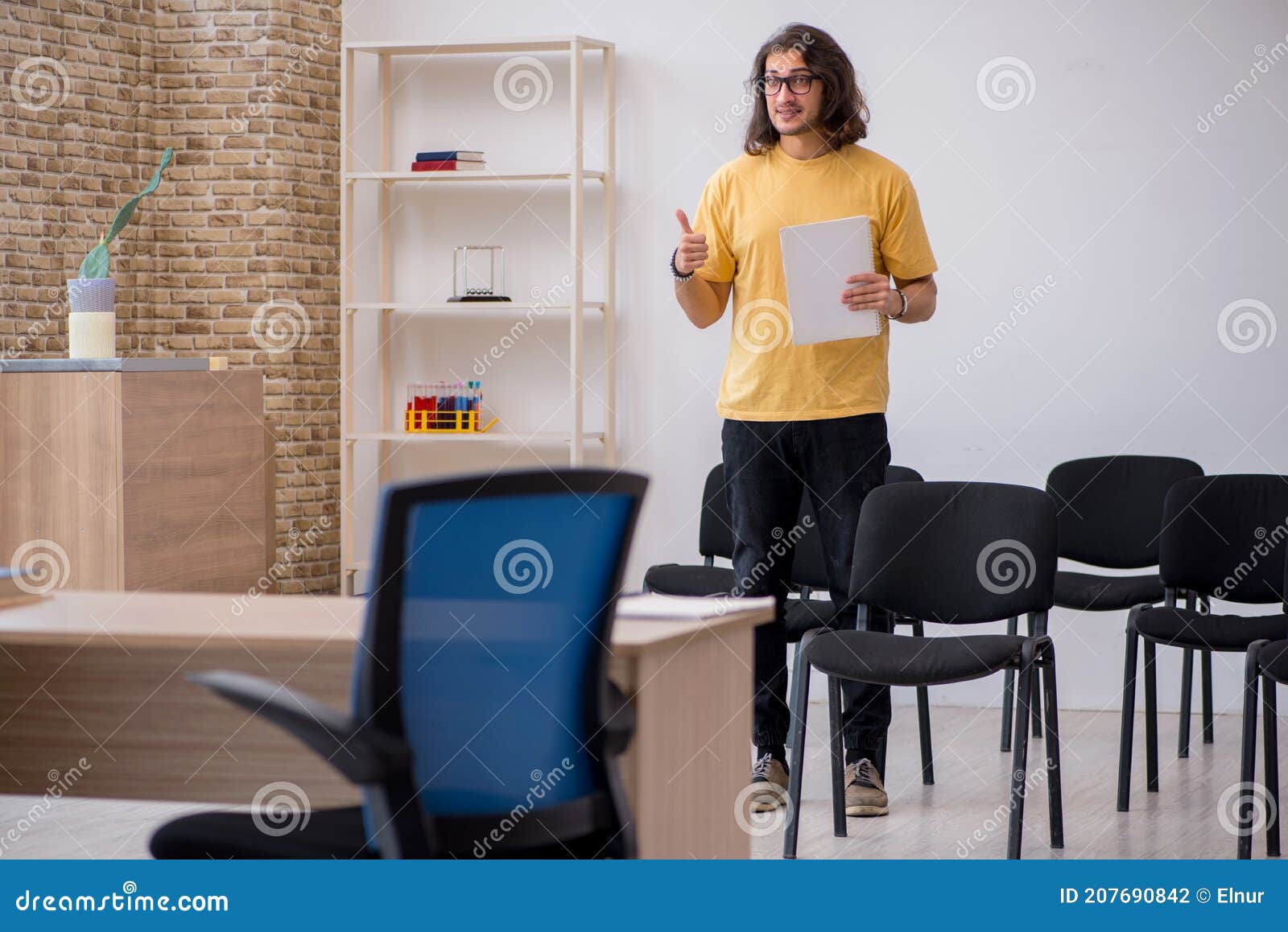 Young Male Student Waiting for Teacher in the Classroom Stock Photo ...
