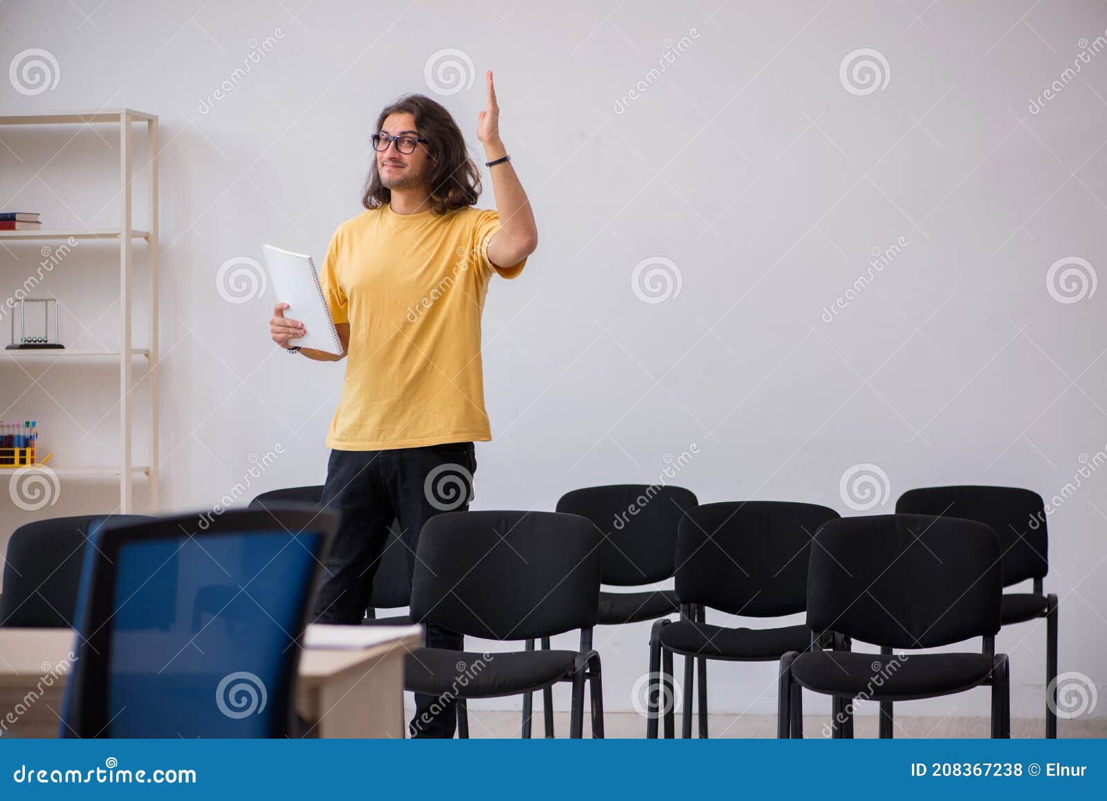 Young Male Student Waiting for Teacher in the Classroom Stock Photo ...