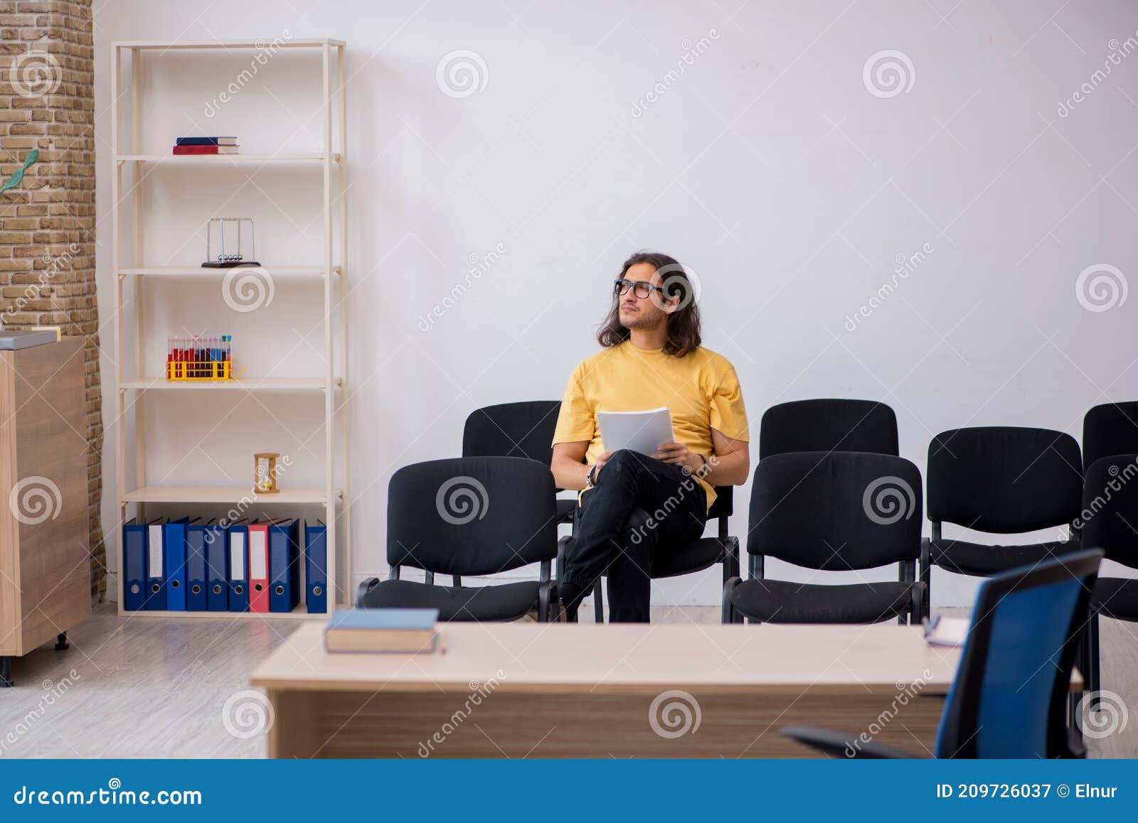 Young Male Student Waiting for Teacher in the Classroom Stock Image ...