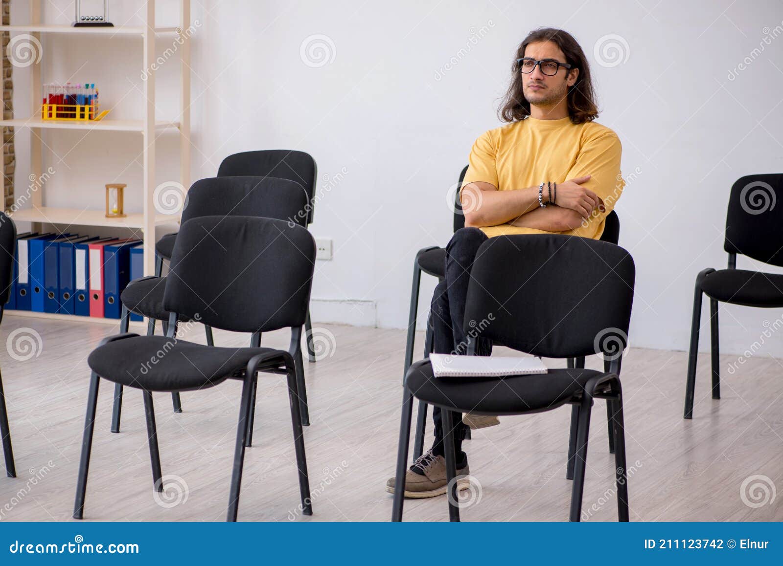 Young Male Student Waiting for Teacher in the Classroom Stock Photo ...