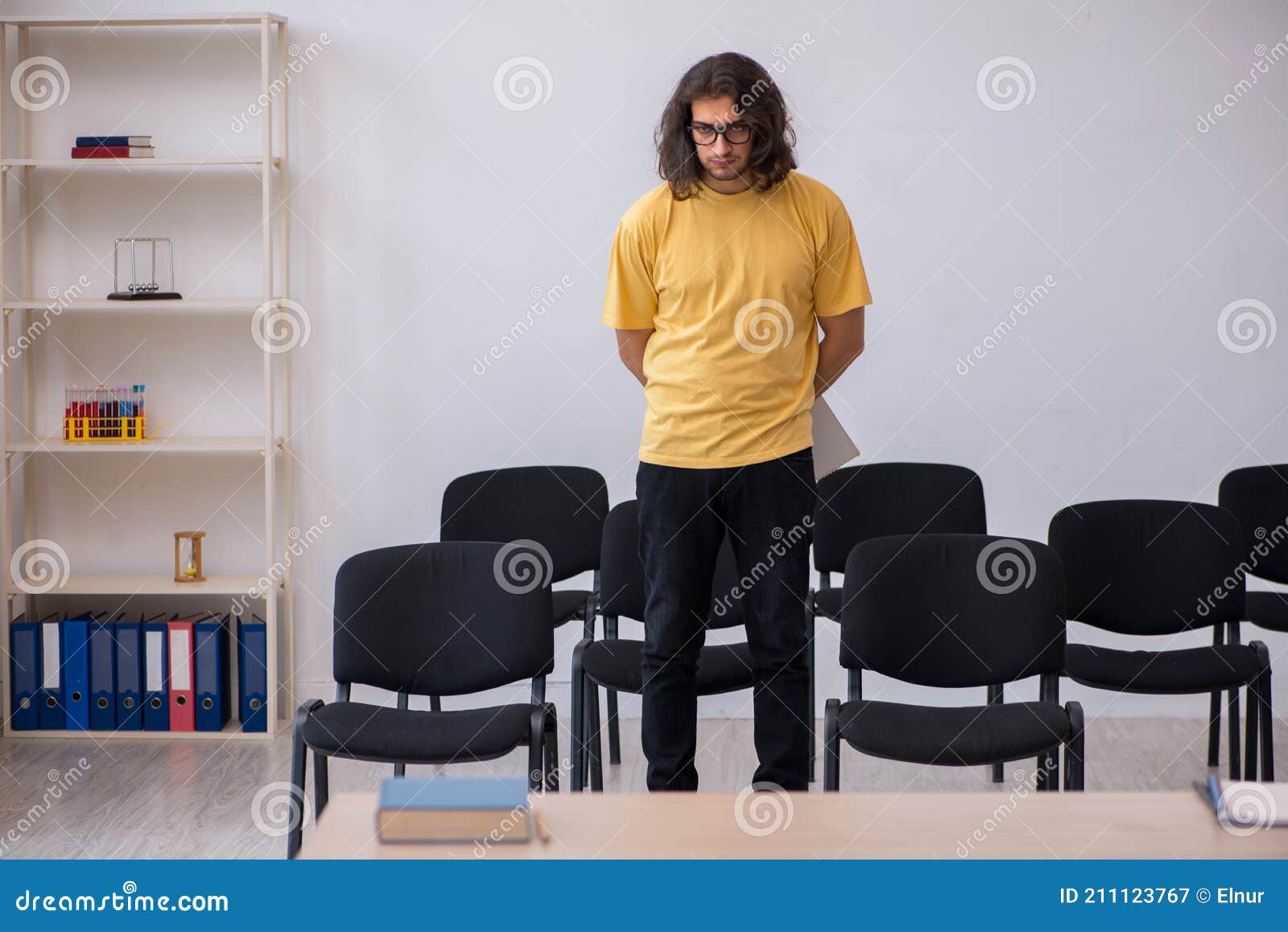 Young Male Student Waiting for Teacher in the Classroom Stock Image ...