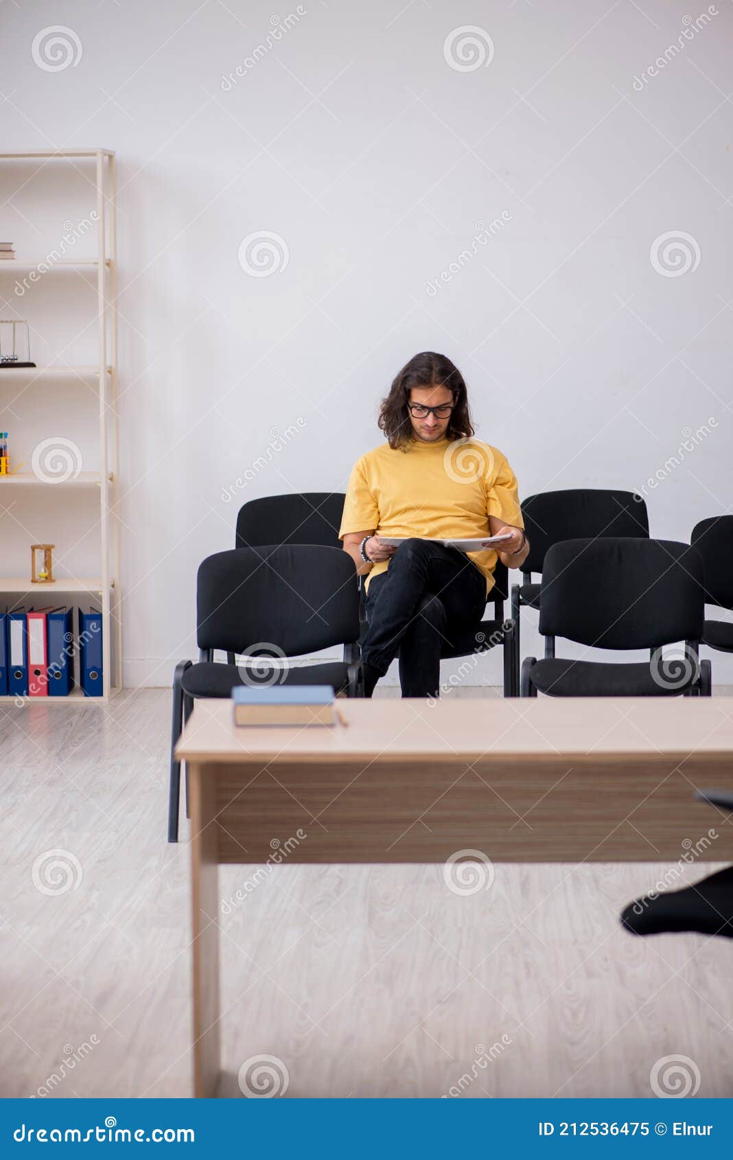 Young Male Student Waiting for Teacher in the Classroom Stock Image ...