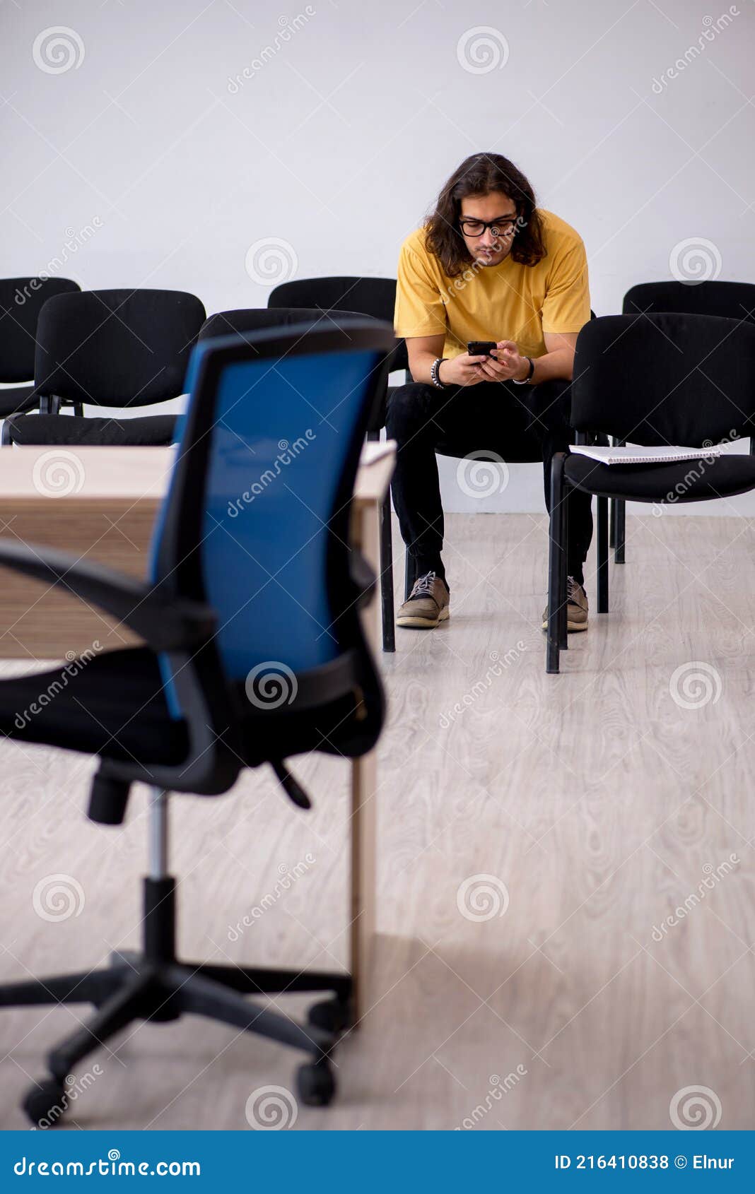 Young Male Student Waiting for Teacher in the Classroom Stock Photo ...