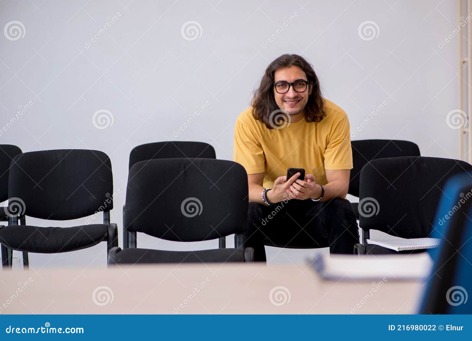 Young Male Student Waiting for Teacher in the Classroom Stock Photo ...