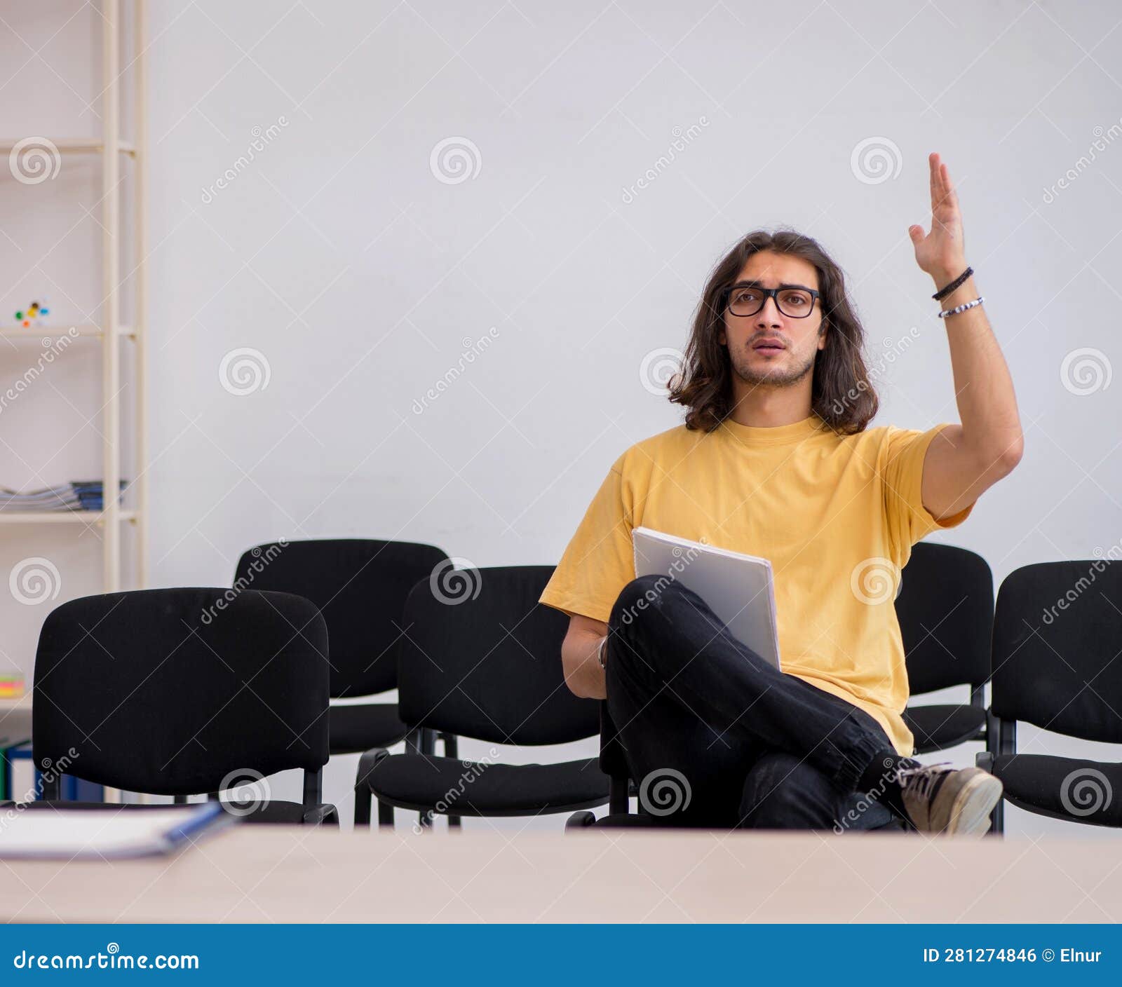 Young Male Student Waiting for Teacher in the Classroom Stock Photo ...