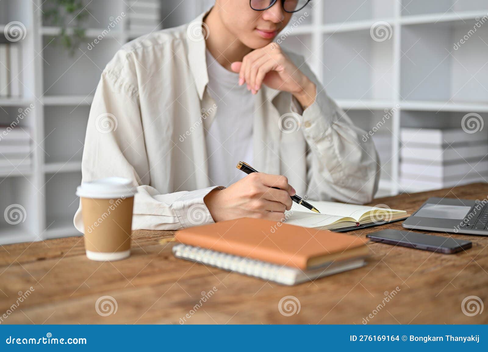 Young Male Student Writing and Taking Note on Notebook Stock Photo ...