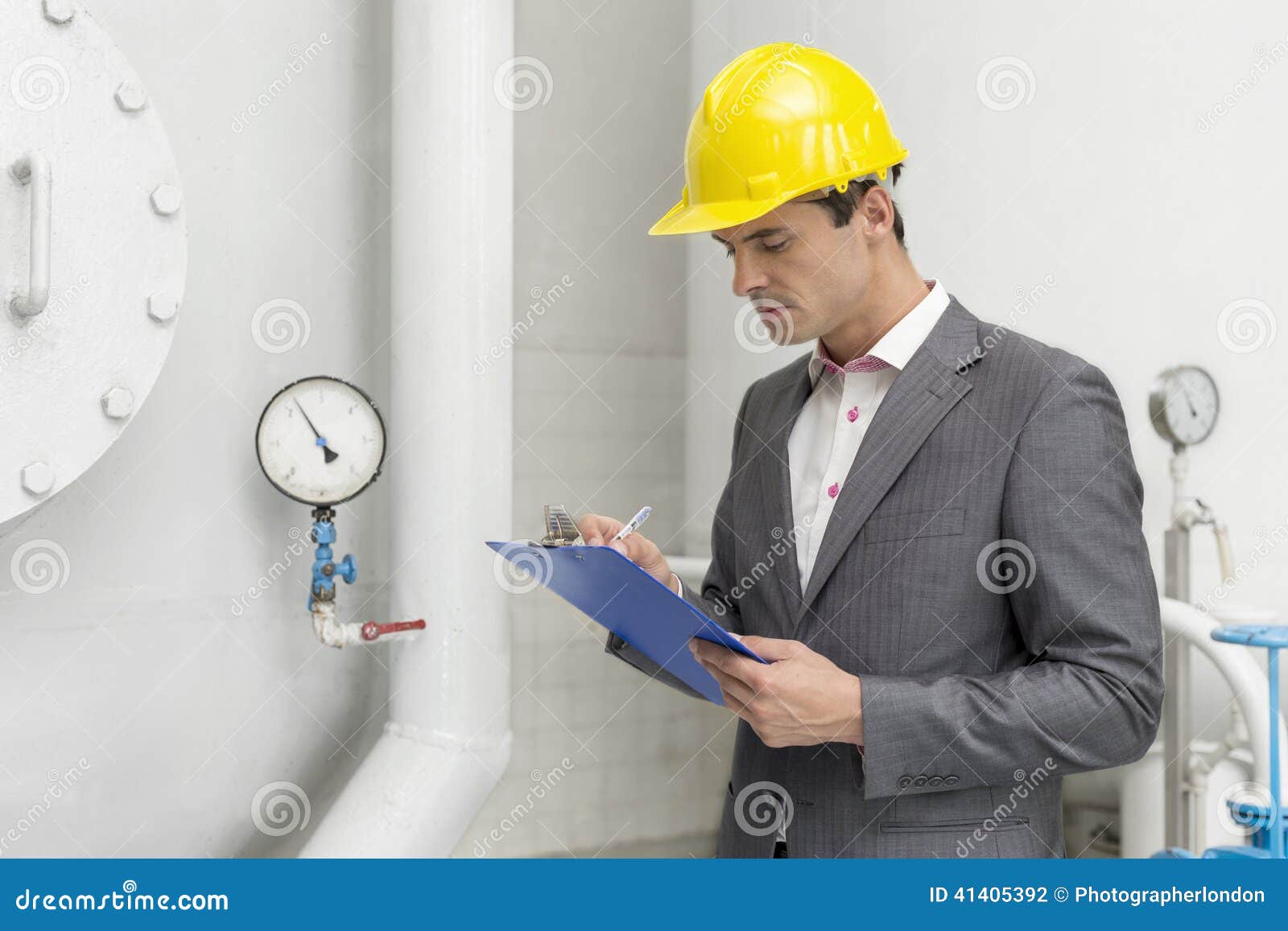 Young Male Supervisor Inspecting Pipeline in Industry Stock Photo ...