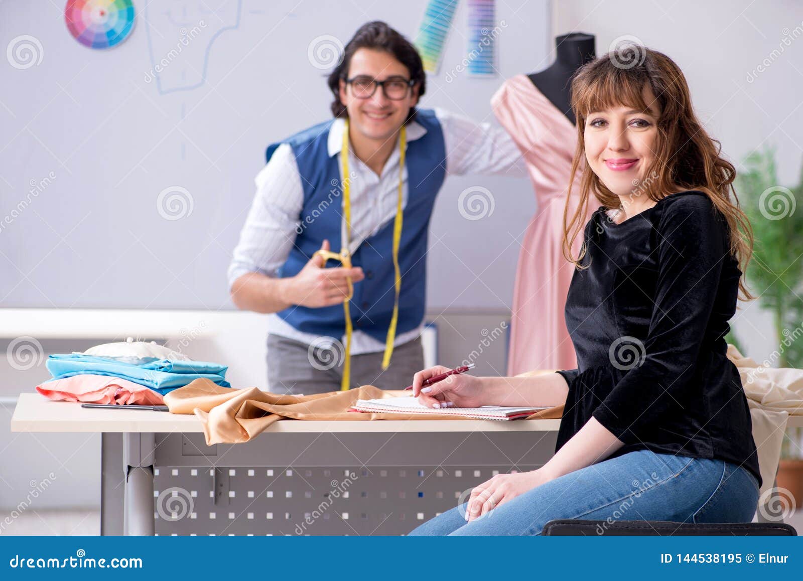 The Young Male Tailor Teaching Female Student Stock Image - Image of ...
