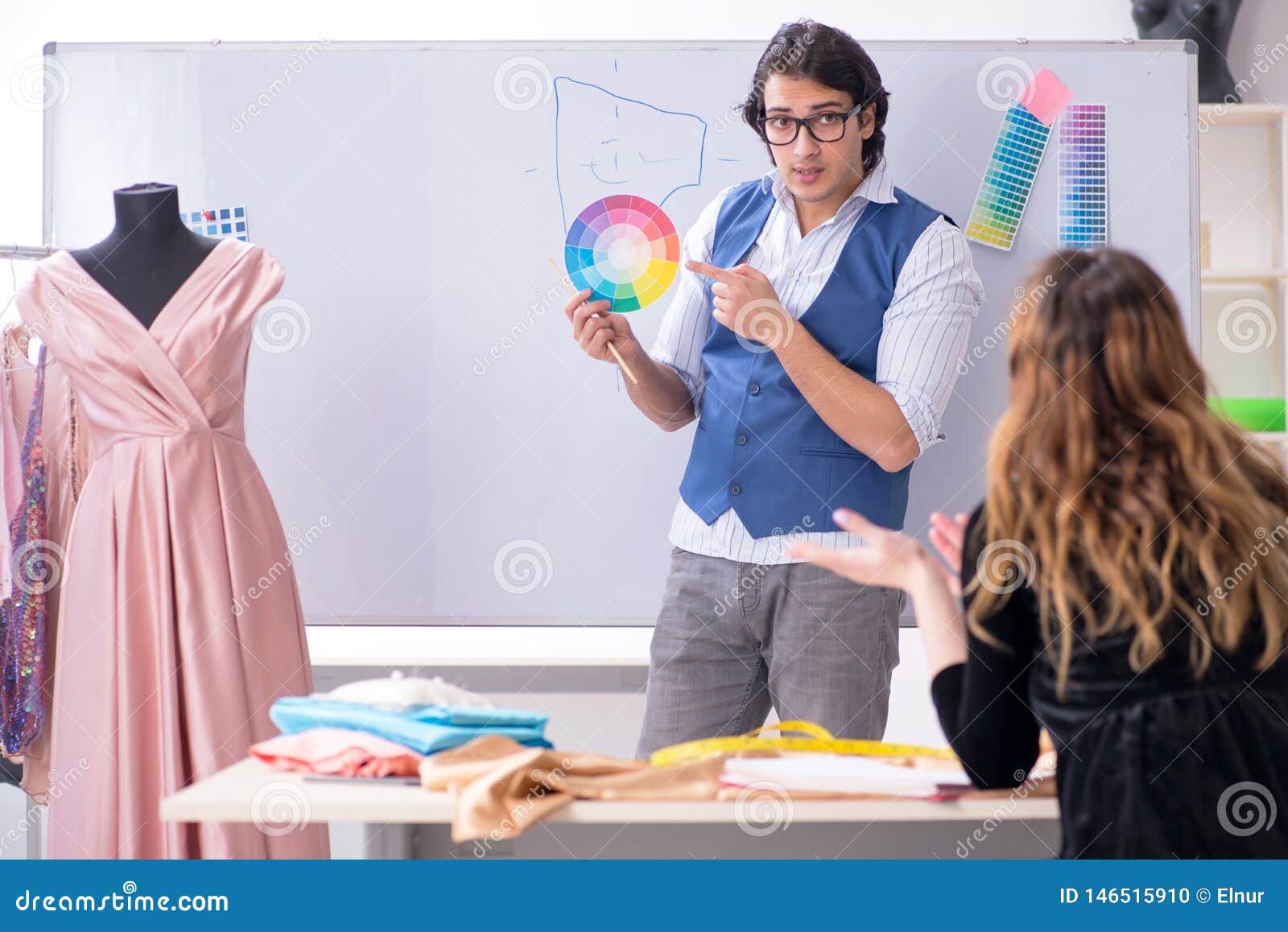 The Young Male Tailor Teaching Female Student Stock Photo - Image of ...