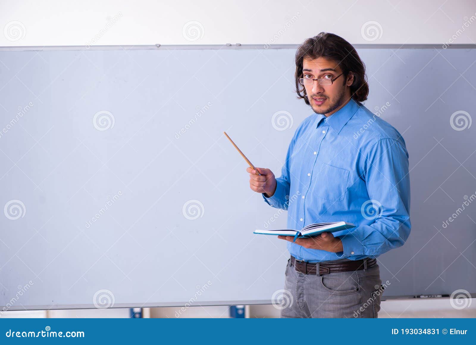 Young Male Teacher in the Classroom Stock Image - Image of classroom ...