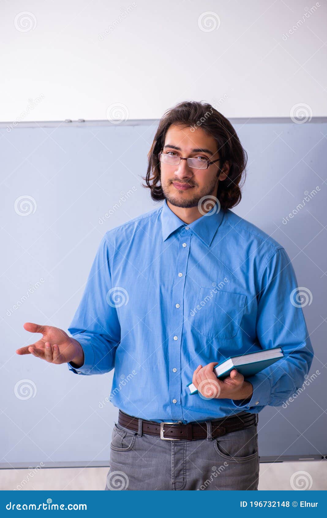 Young Male Teacher in the Classroom Stock Photo - Image of presenting ...