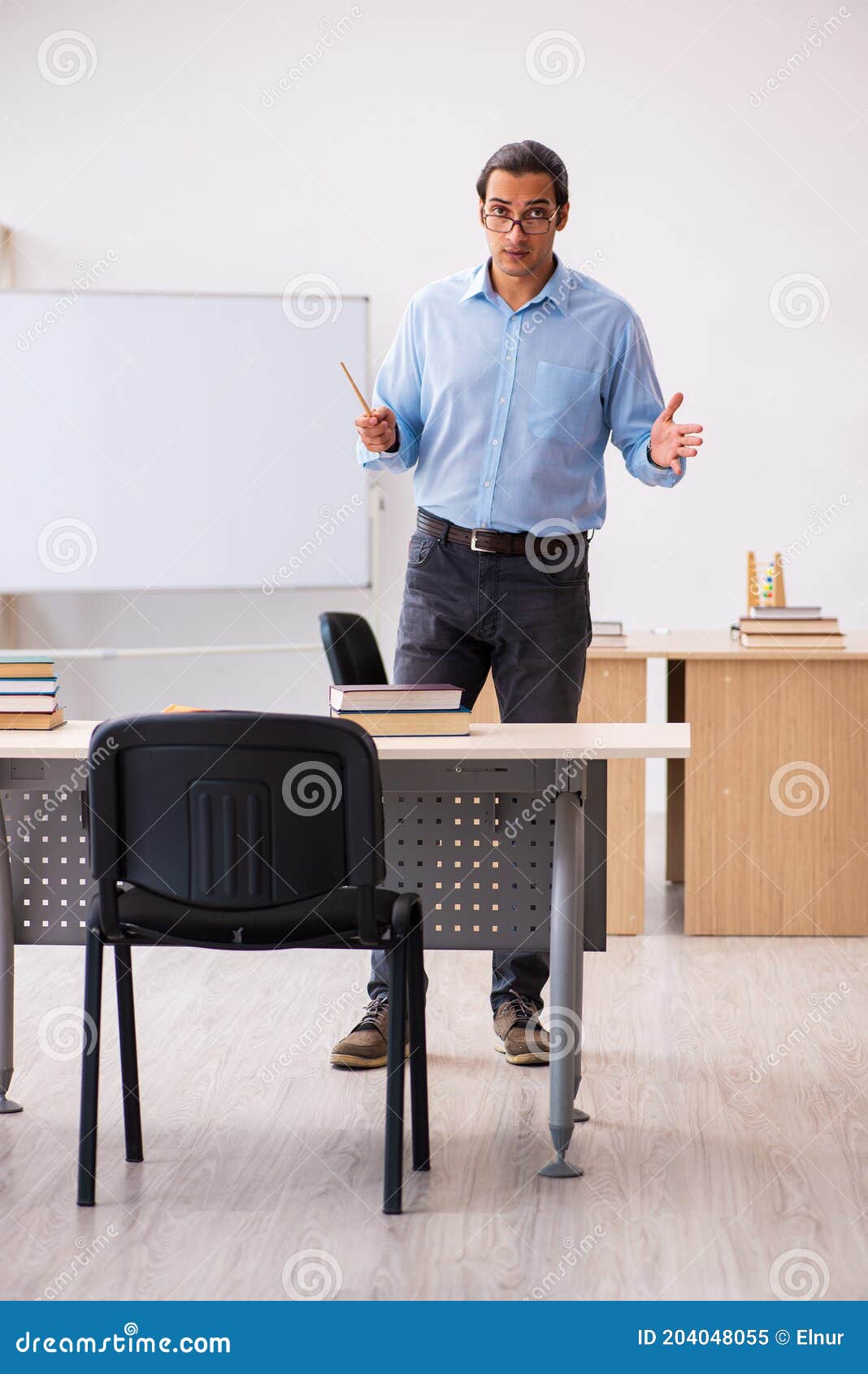 Young Male Teacher in the Classroom Stock Image - Image of academic ...