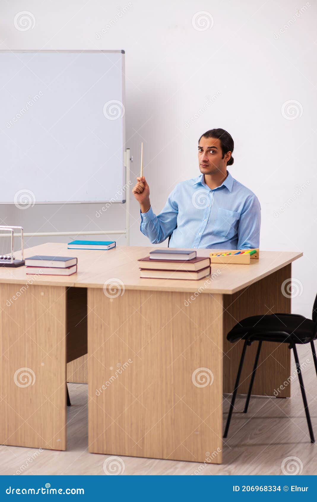 Young Male Teacher in the Classroom Stock Photo - Image of learning ...