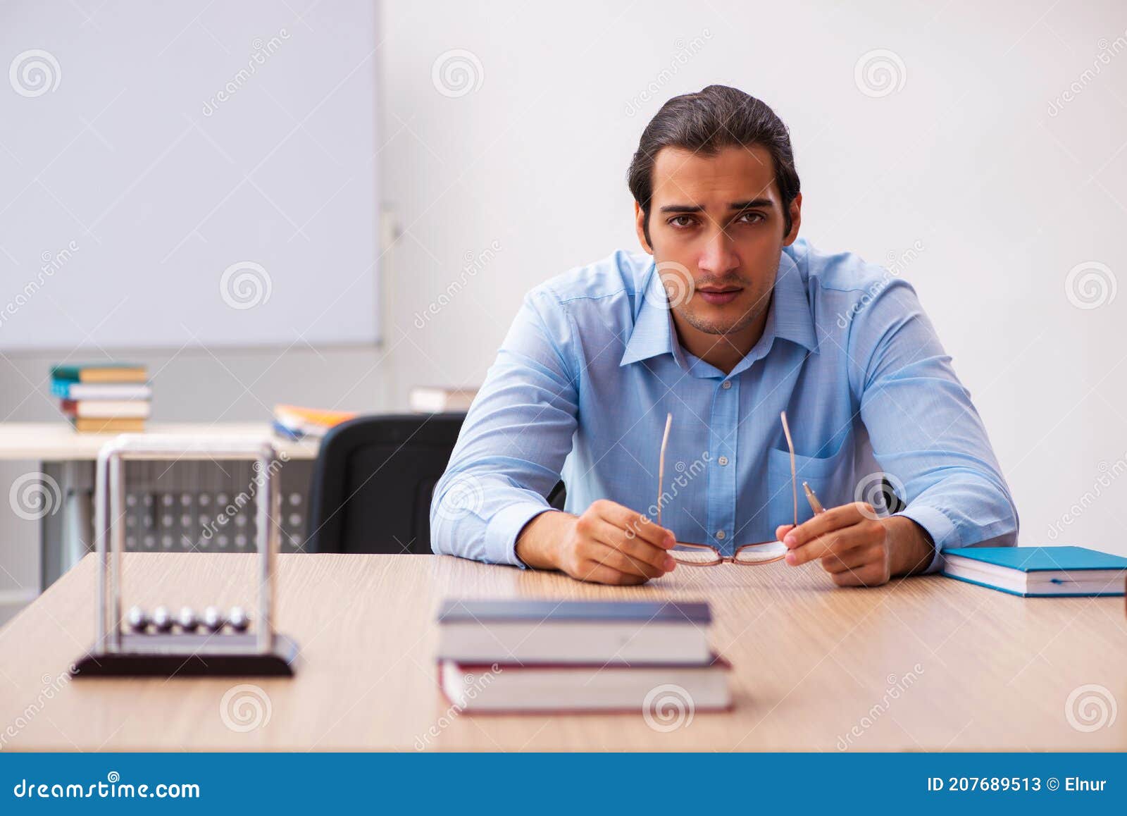 Young Male Teacher in the Classroom Stock Image - Image of stressed ...