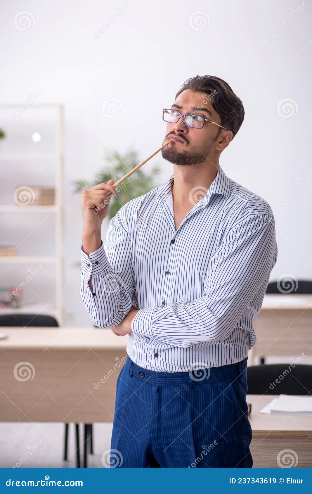 Young Male Teacher in the Classroom Stock Image - Image of discussing ...