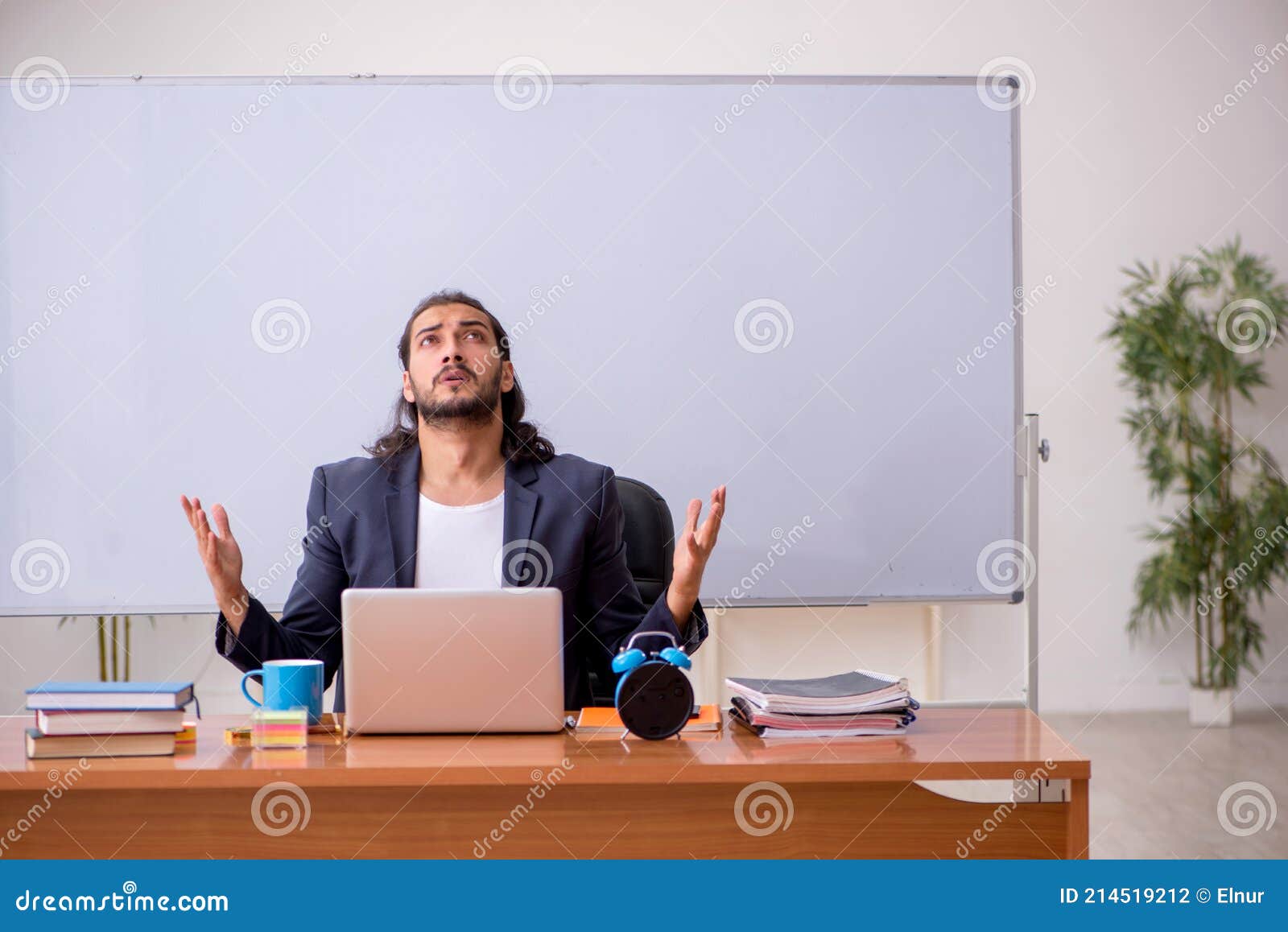 Young Male Teacher in the Classroom Stock Photo - Image of school ...