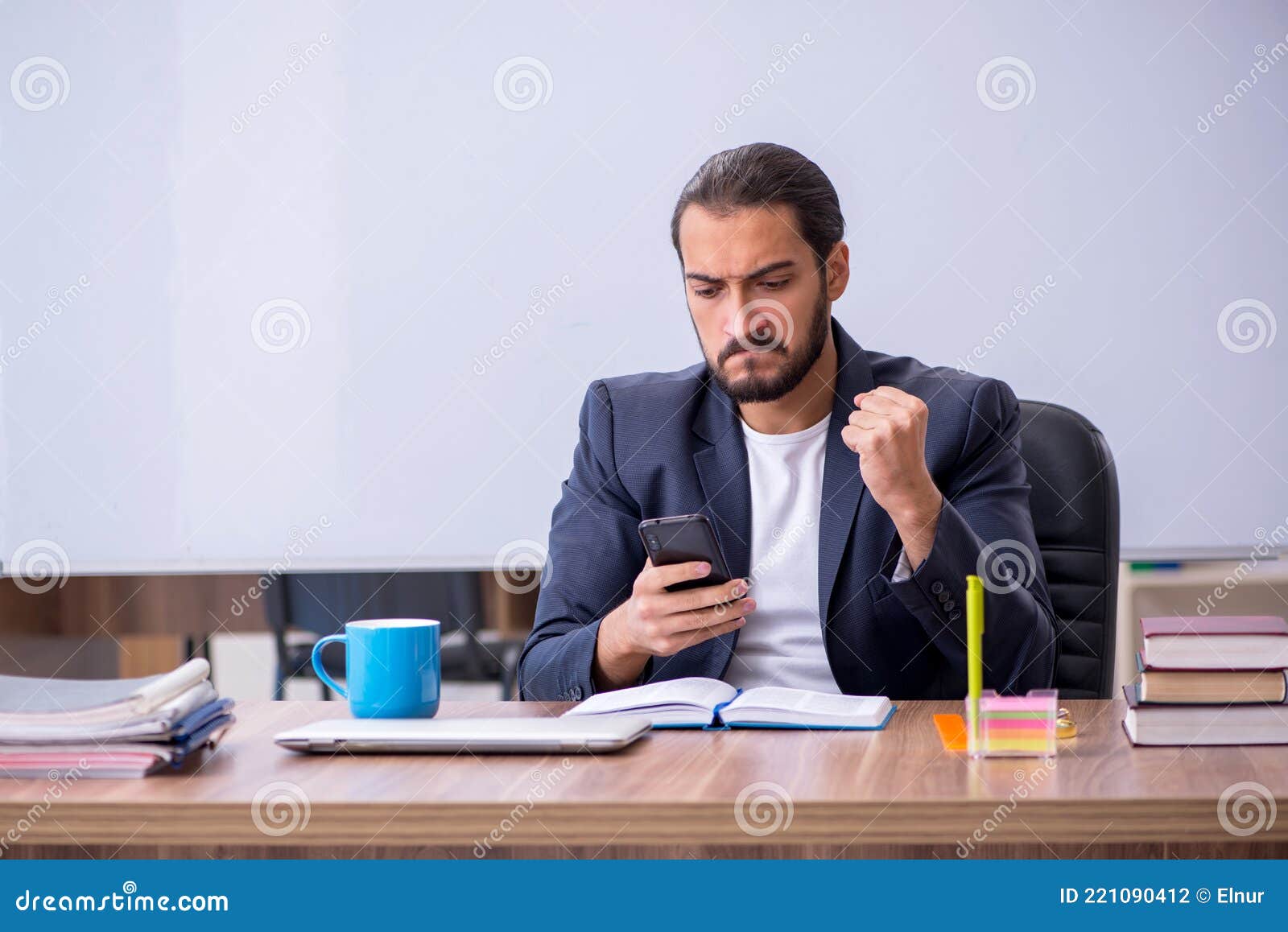 Young Male Teacher in the Classroom Stock Photo - Image of teaching ...