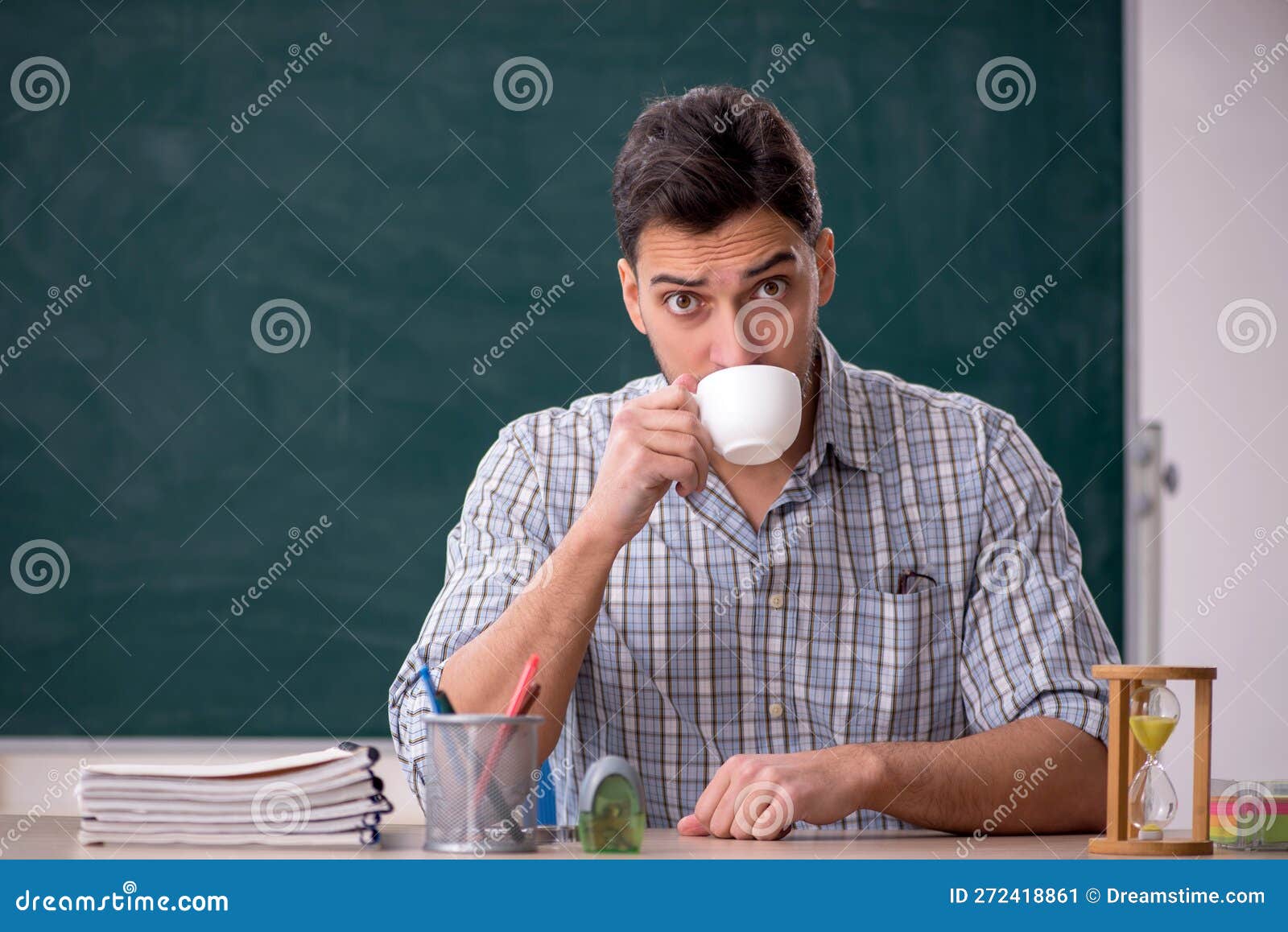 Young Male Teacher Drinking Tea in the Classroom Stock Image - Image of ...