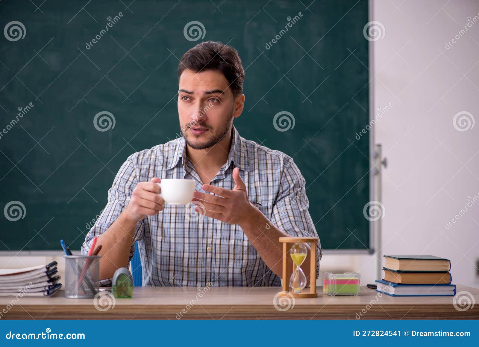 Young Male Teacher Drinking Tea in the Classroom Stock Image - Image of ...