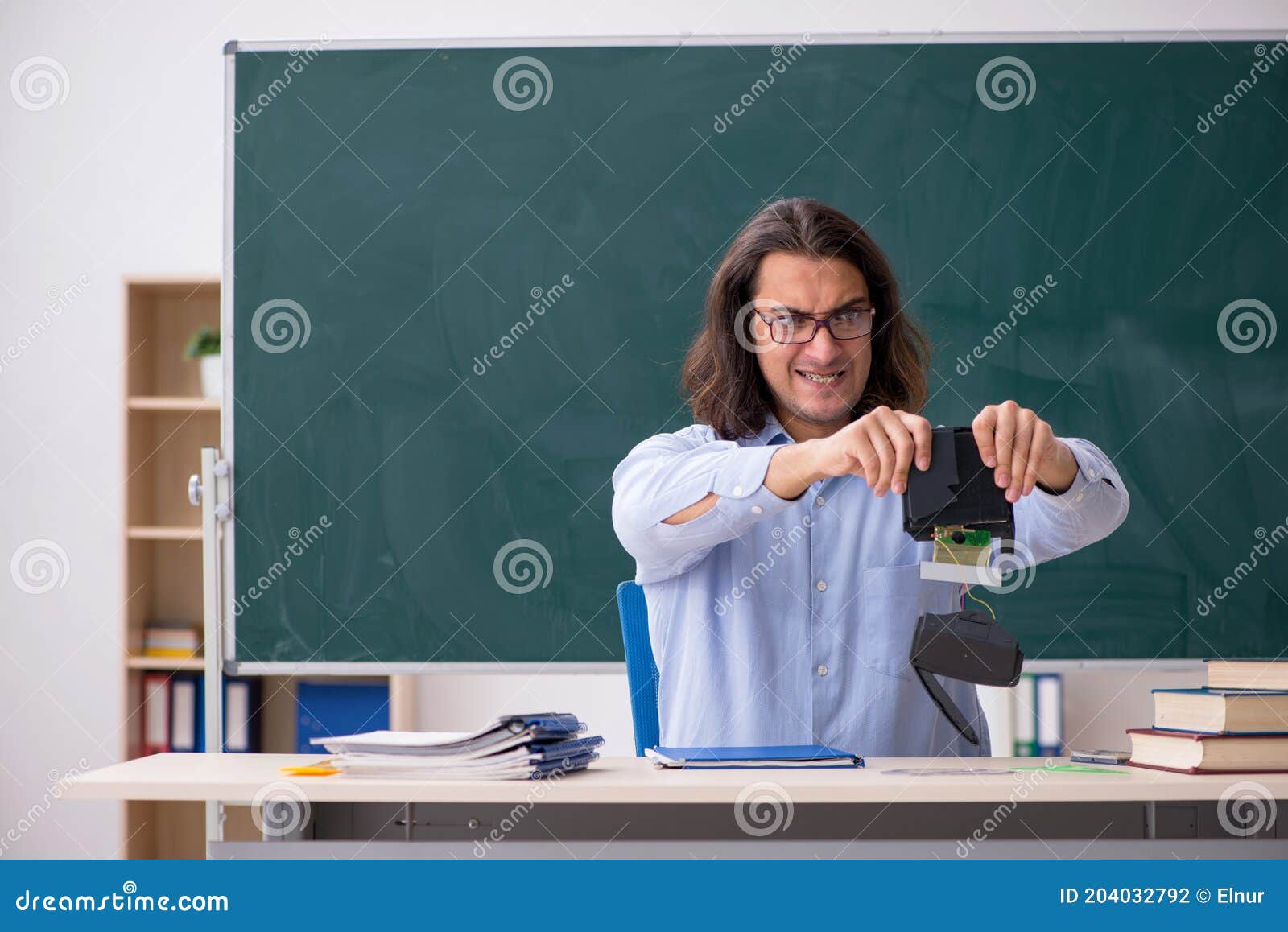 Young Male Teacher in Front of Green Board Stock Photo - Image of ...