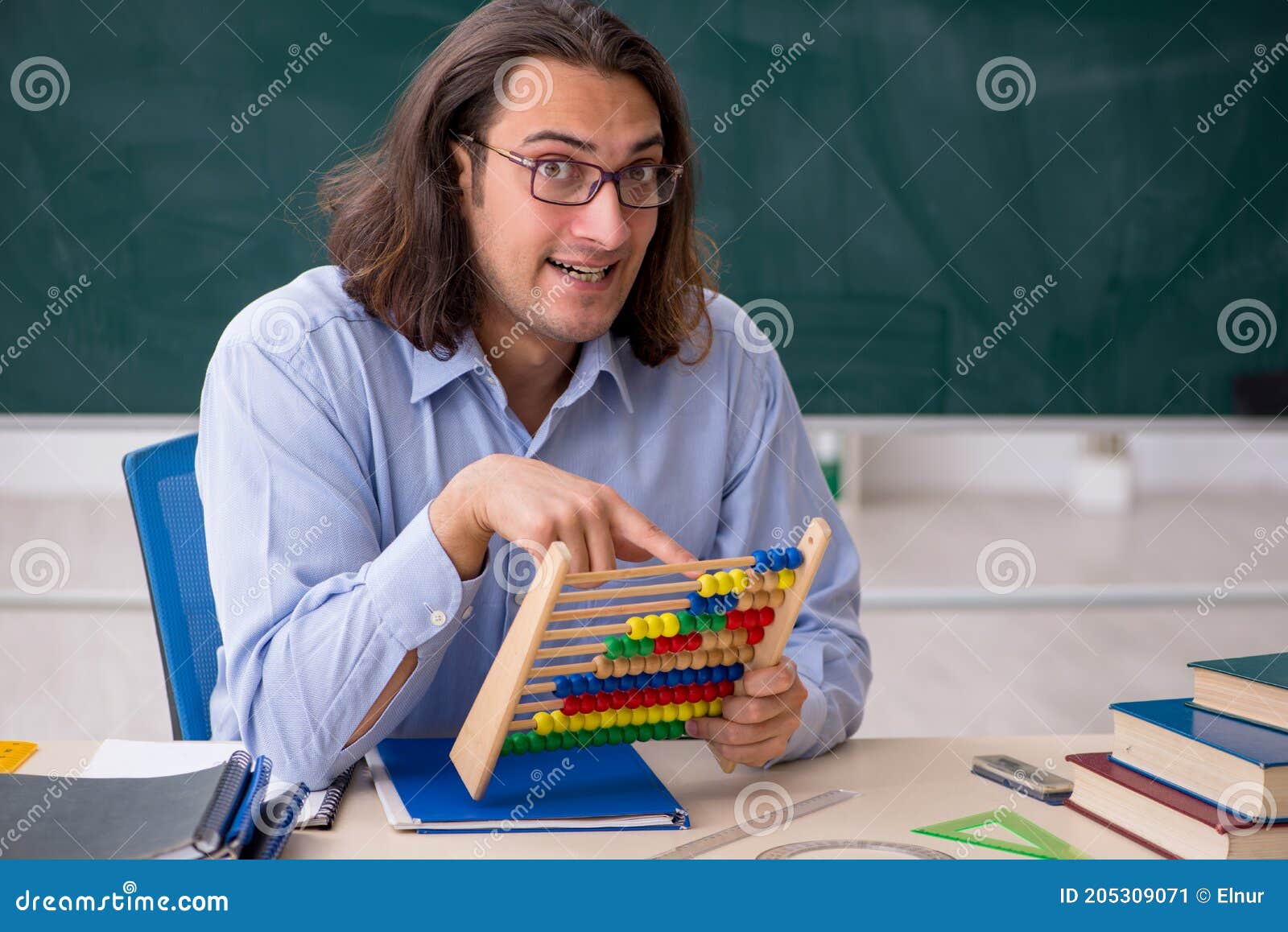 Young Male Teacher in Front of Green Board Stock Image - Image of board ...