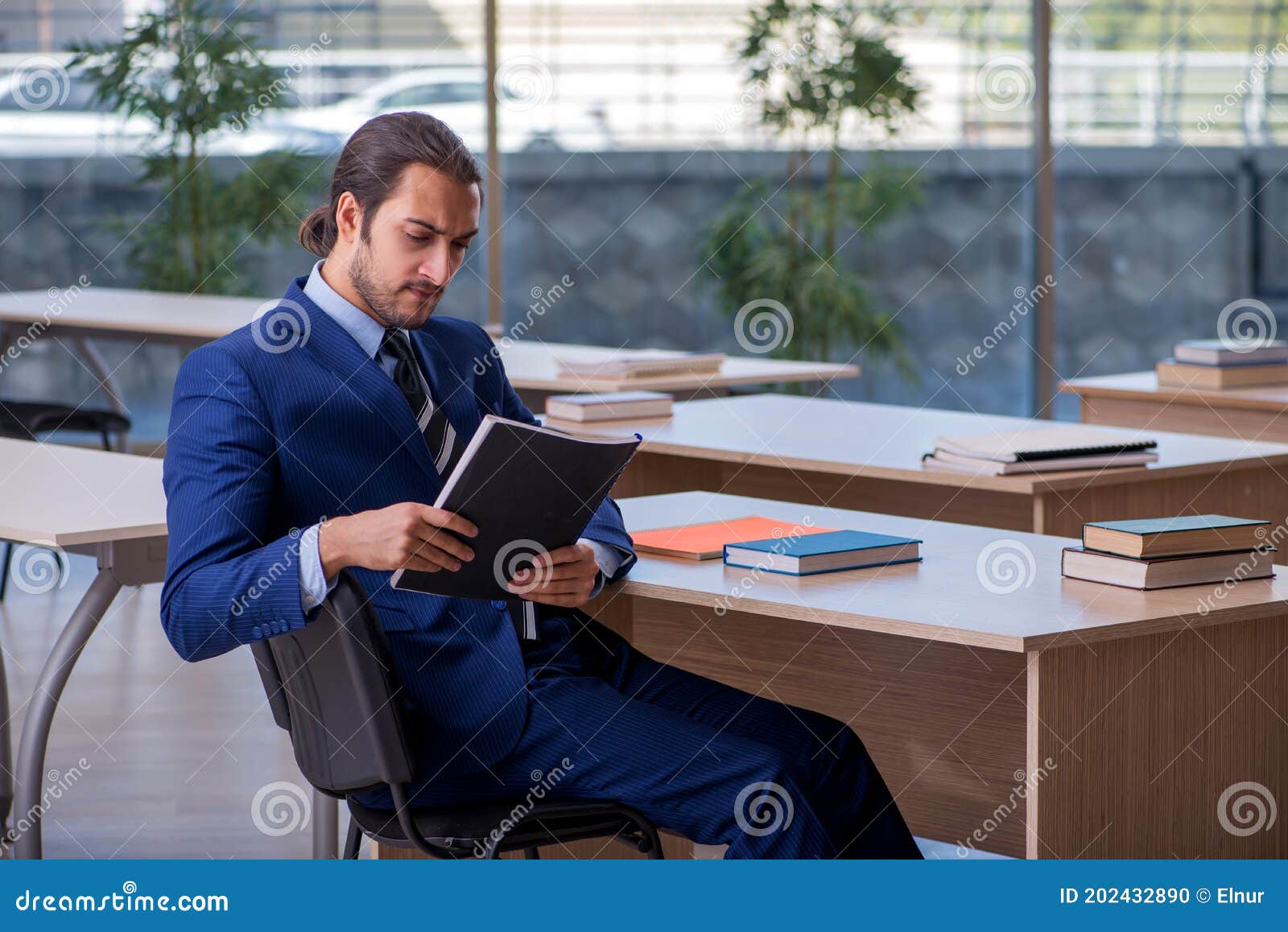 Young Male Teacher in Suit in the Classroom Stock Photo - Image of ...