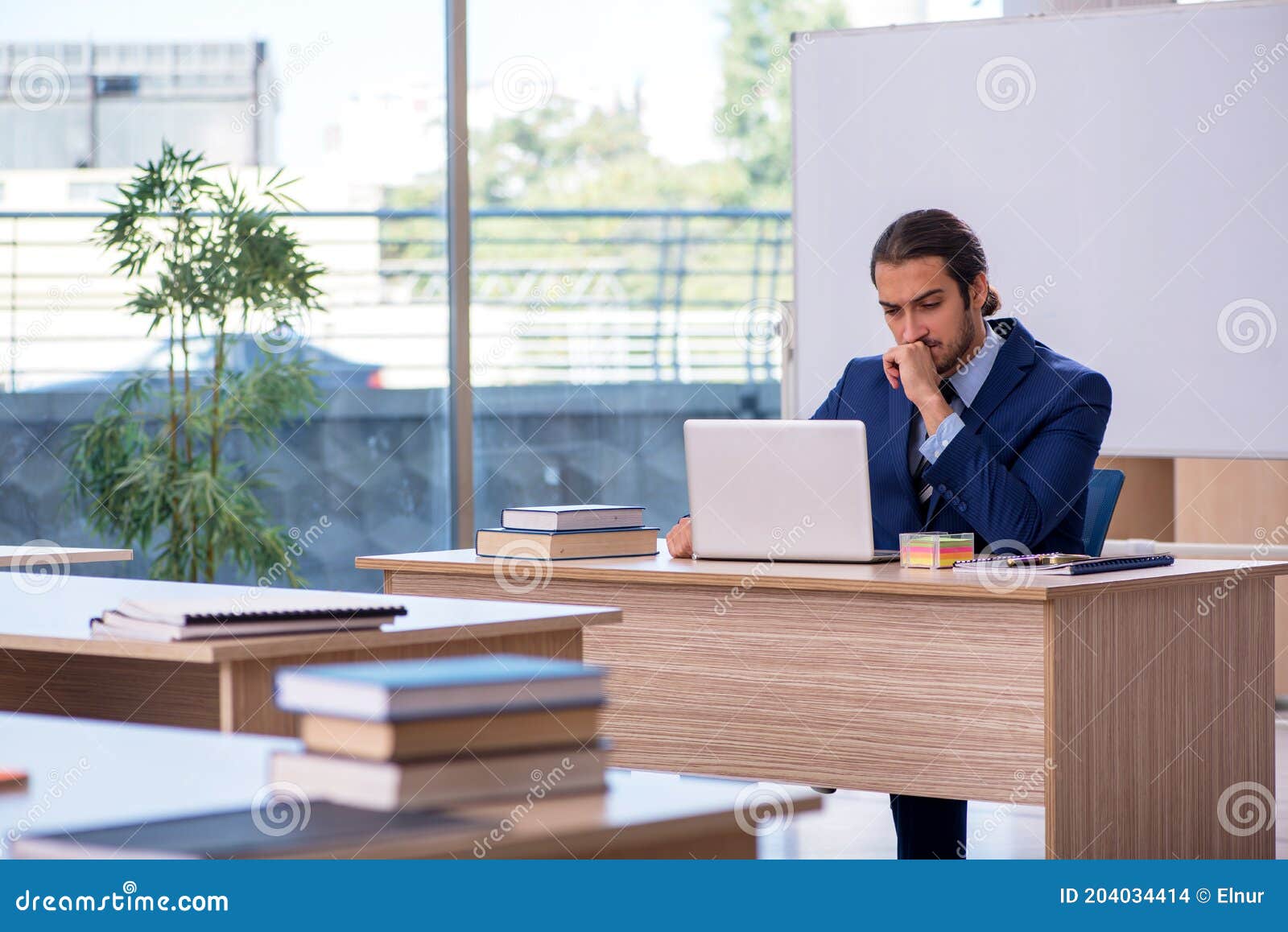 Young Male Teacher in Suit in the Classroom Stock Photo - Image of ...