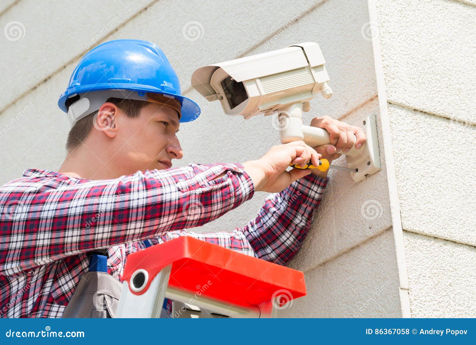 Technician Installing Camera on Wall Stock Photo - Image of service ...