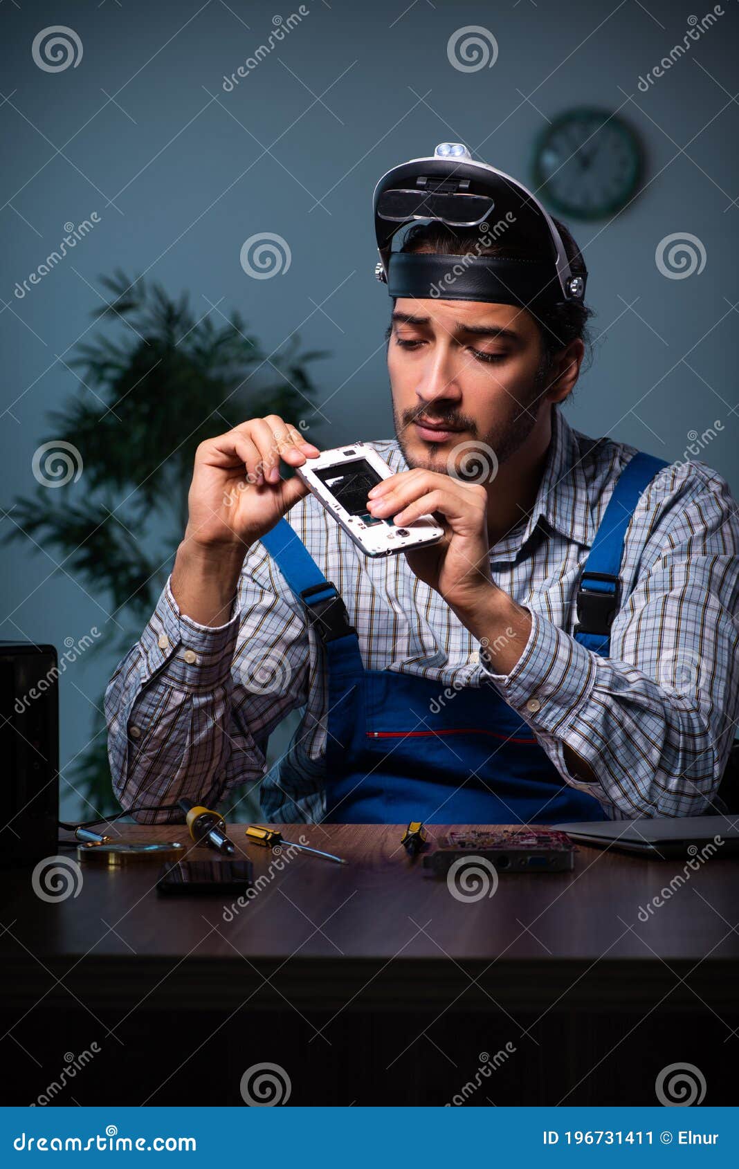 Young Male Technician Repairing Computer in Workshop at Night Stock ...