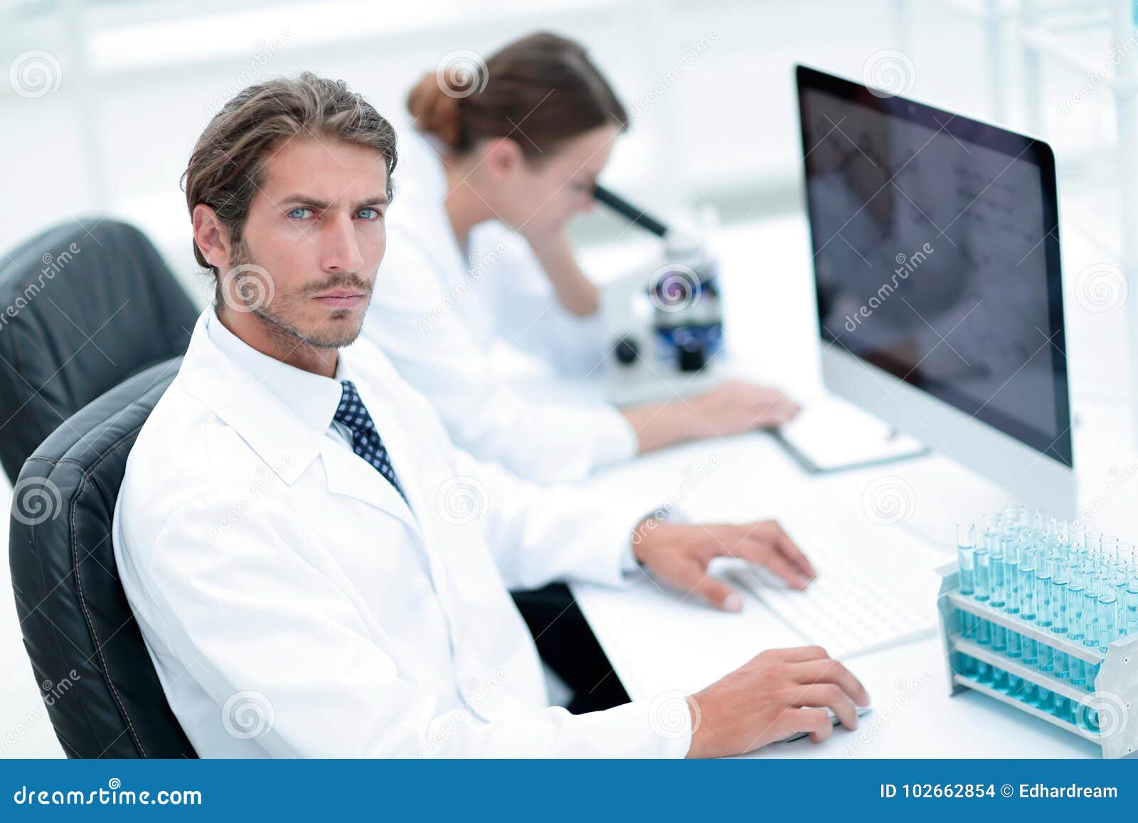 Young Male Technician Working on Computer in Laboratory Stock Photo ...