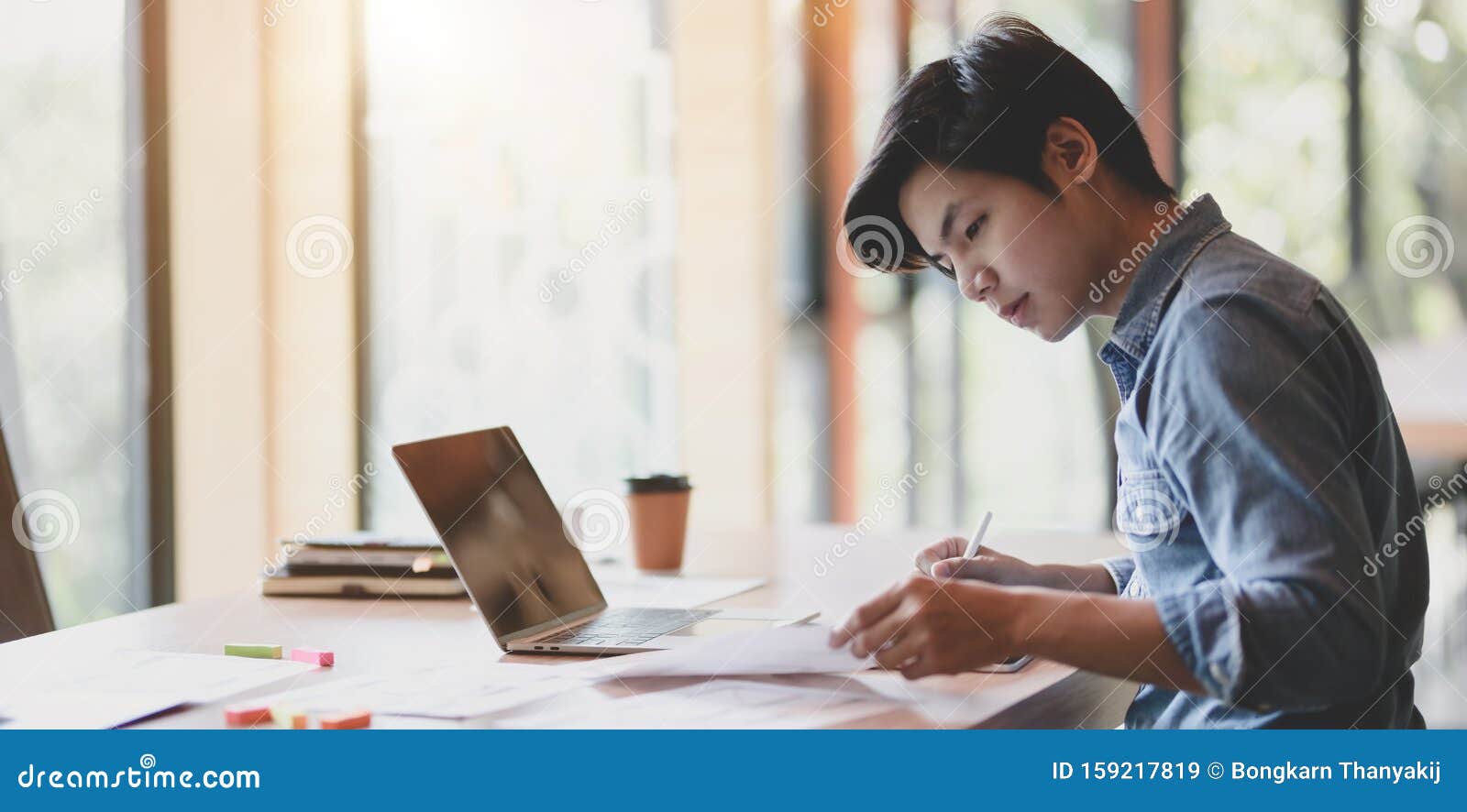 Young Male UI Web Developer Working on His Smartphone Templates with ...