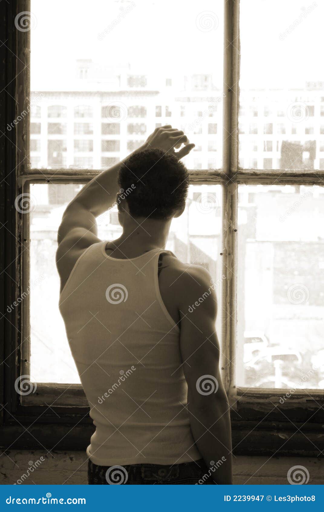 Young male at the window stock image. Image of thinking - 2239947