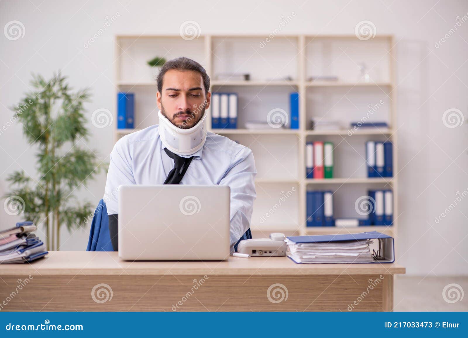 Young Man after Accident Working in the Office Stock Image - Image of ...
