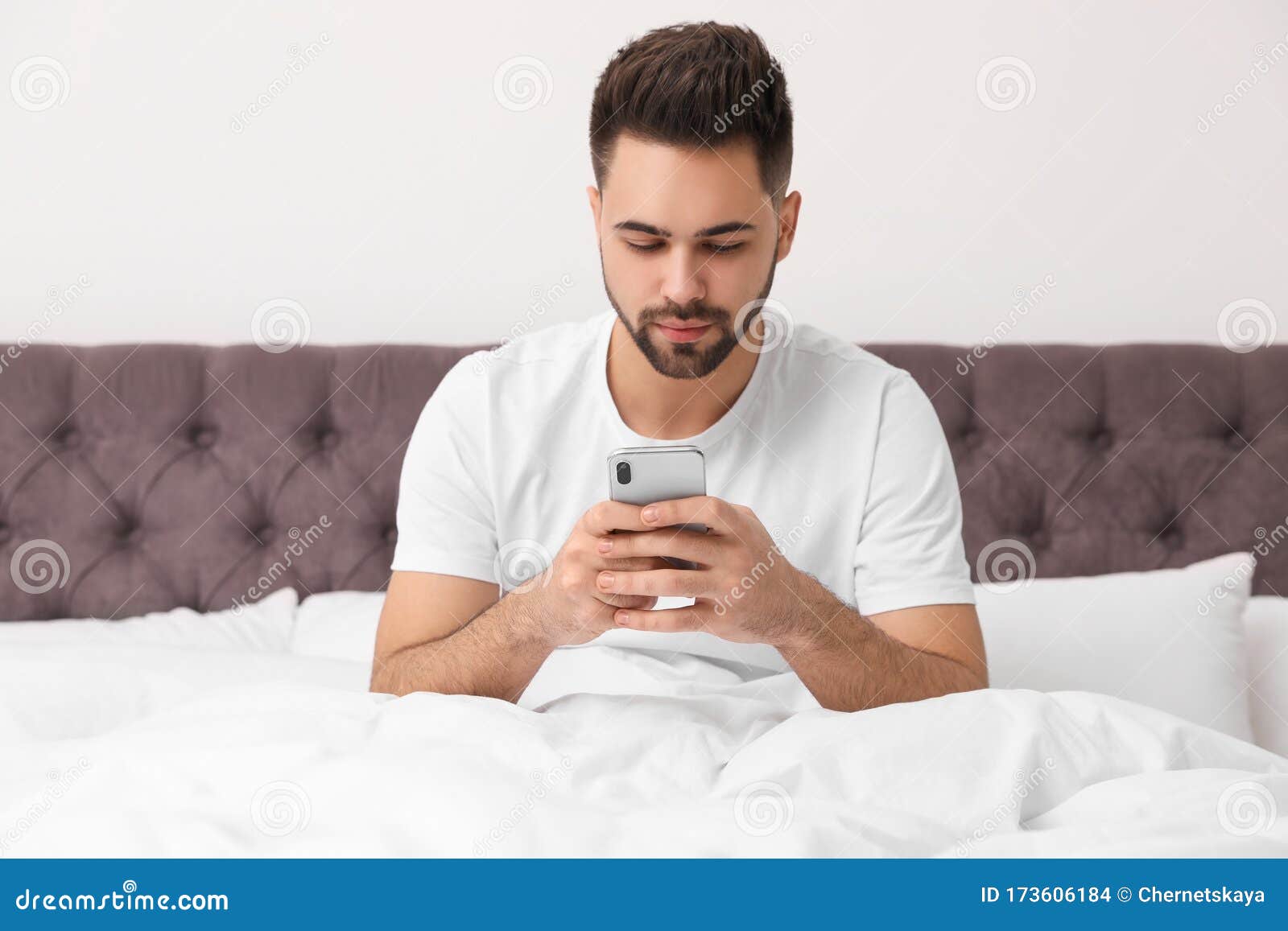 Young Man Addicted To Smartphone in Bed Stock Photo - Image of male ...