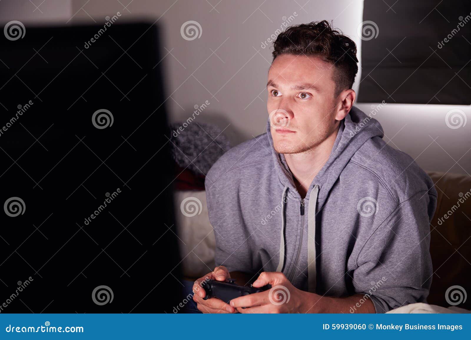 Young Man Addicted To Video Gaming at Home Stock Photo - Image of ...